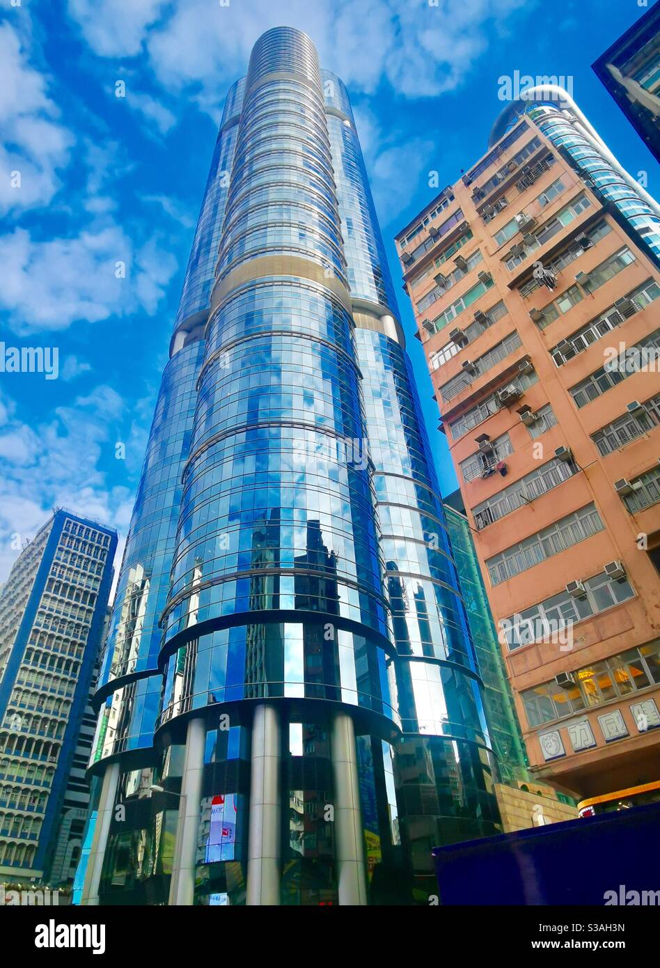 Langham place tower standing next to old buildings in Mongkok, Hong ...