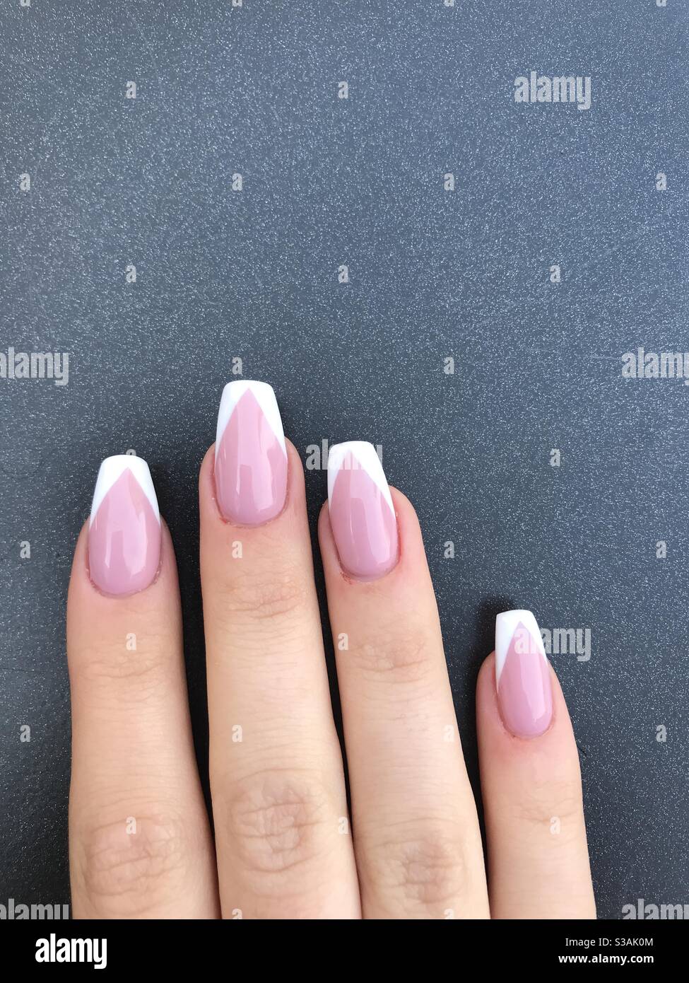 French manicure with sharp angled tips Stock Photo - Alamy