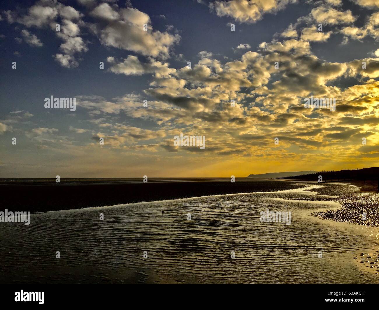 Sunset over wet sand hi-res stock photography and images - Alamy