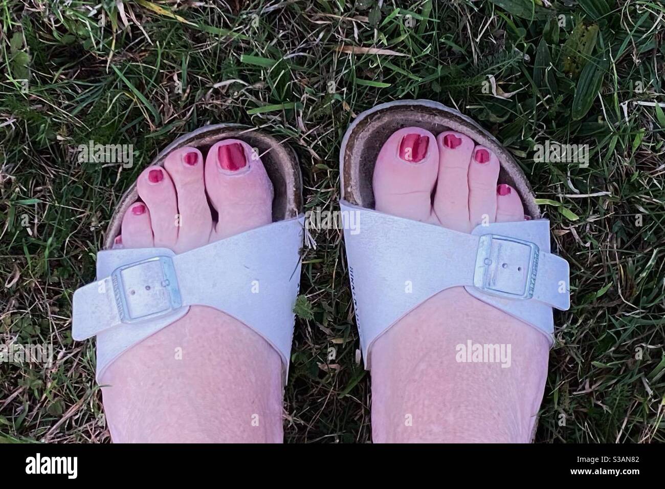 Red Toenails In Sandals