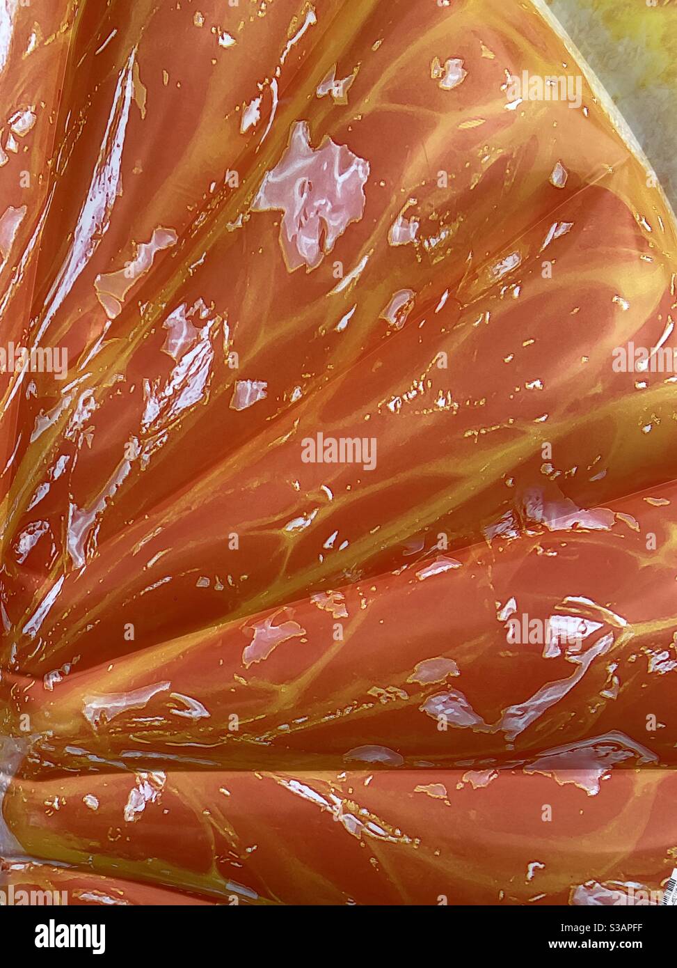 Abstract background of a textured orange swim floaty Stock Photo - Alamy