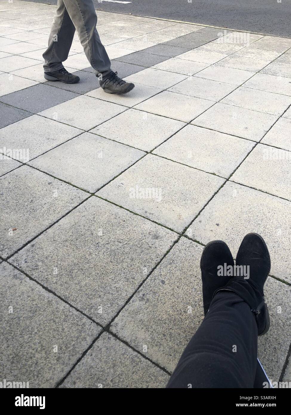 Feet on a pavement Stock Photo - Alamy