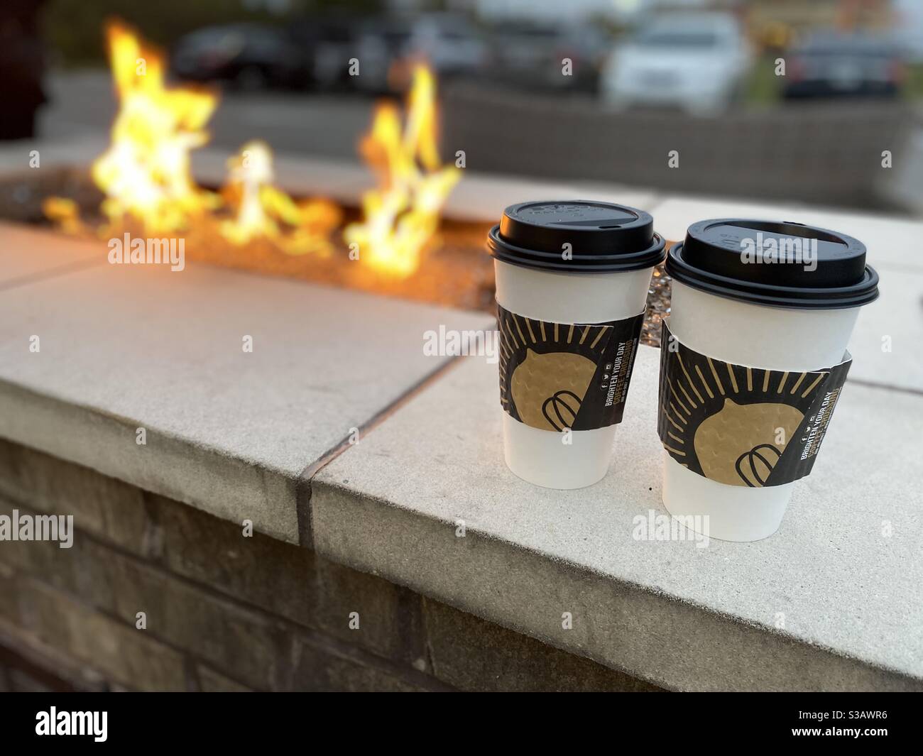 Coffee around a fire Stock Photo - Alamy