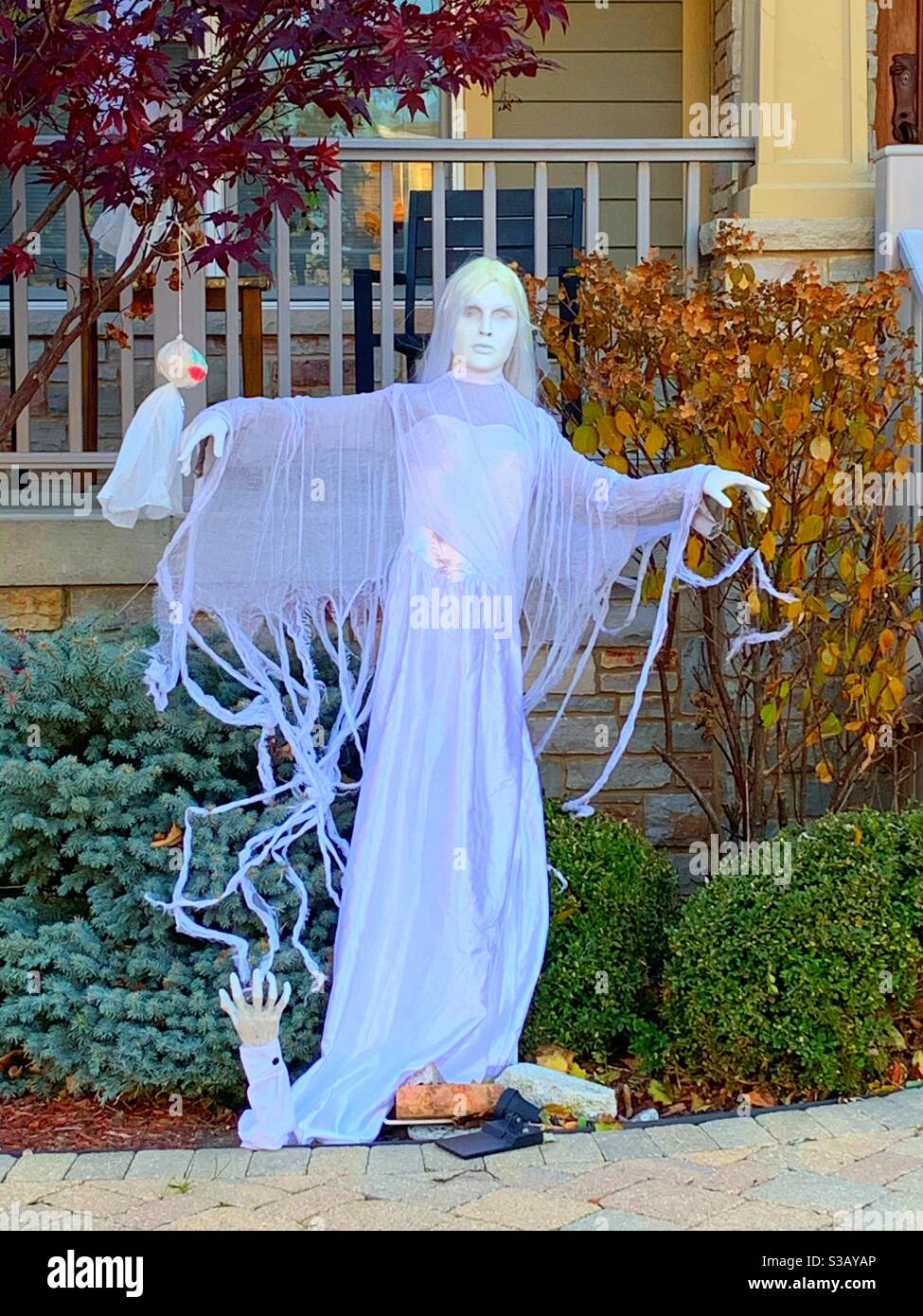 White young woman ghost walking along the side of the house Stock Photo ...