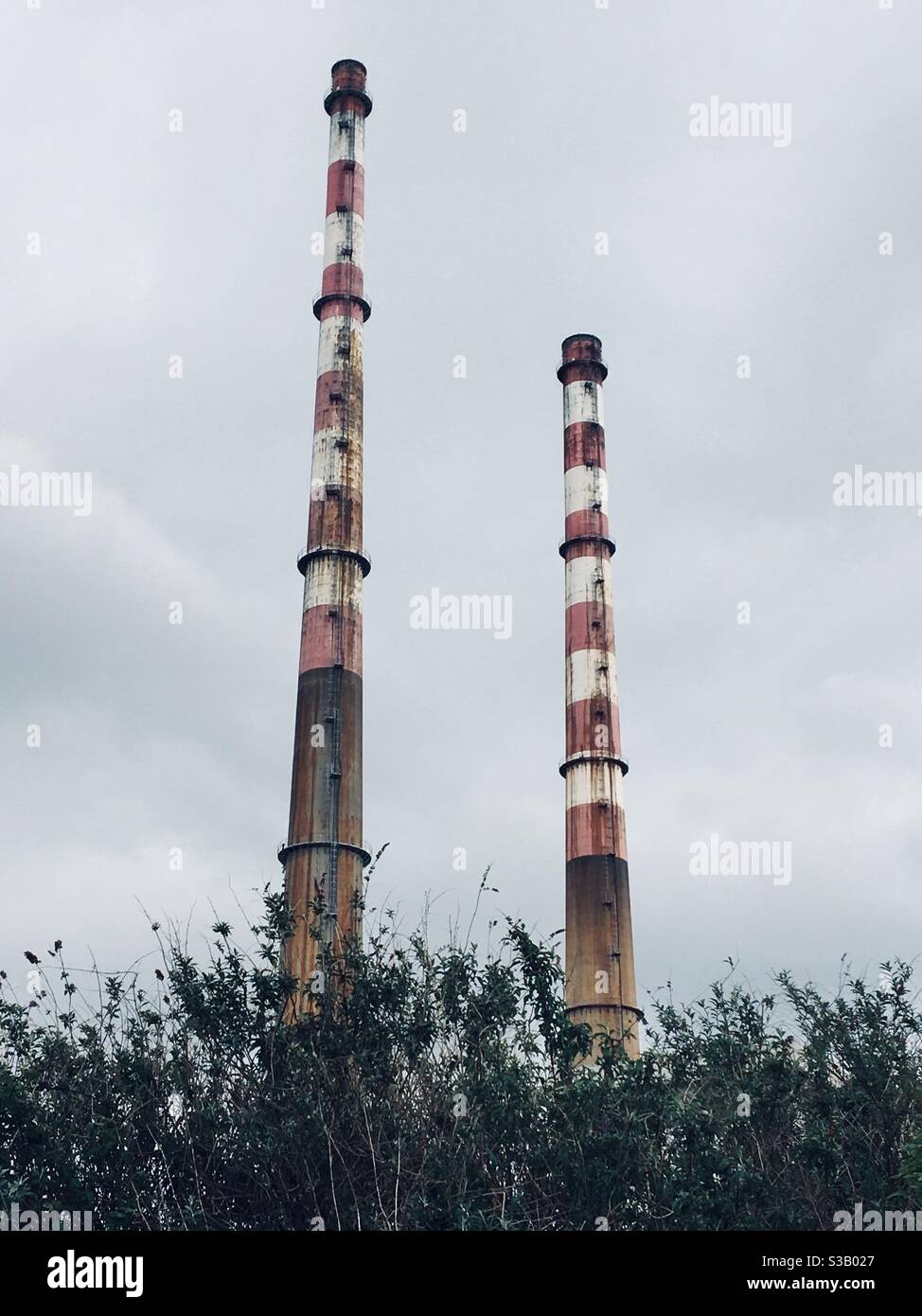 Industrial chimney towers Stock Photo - Alamy