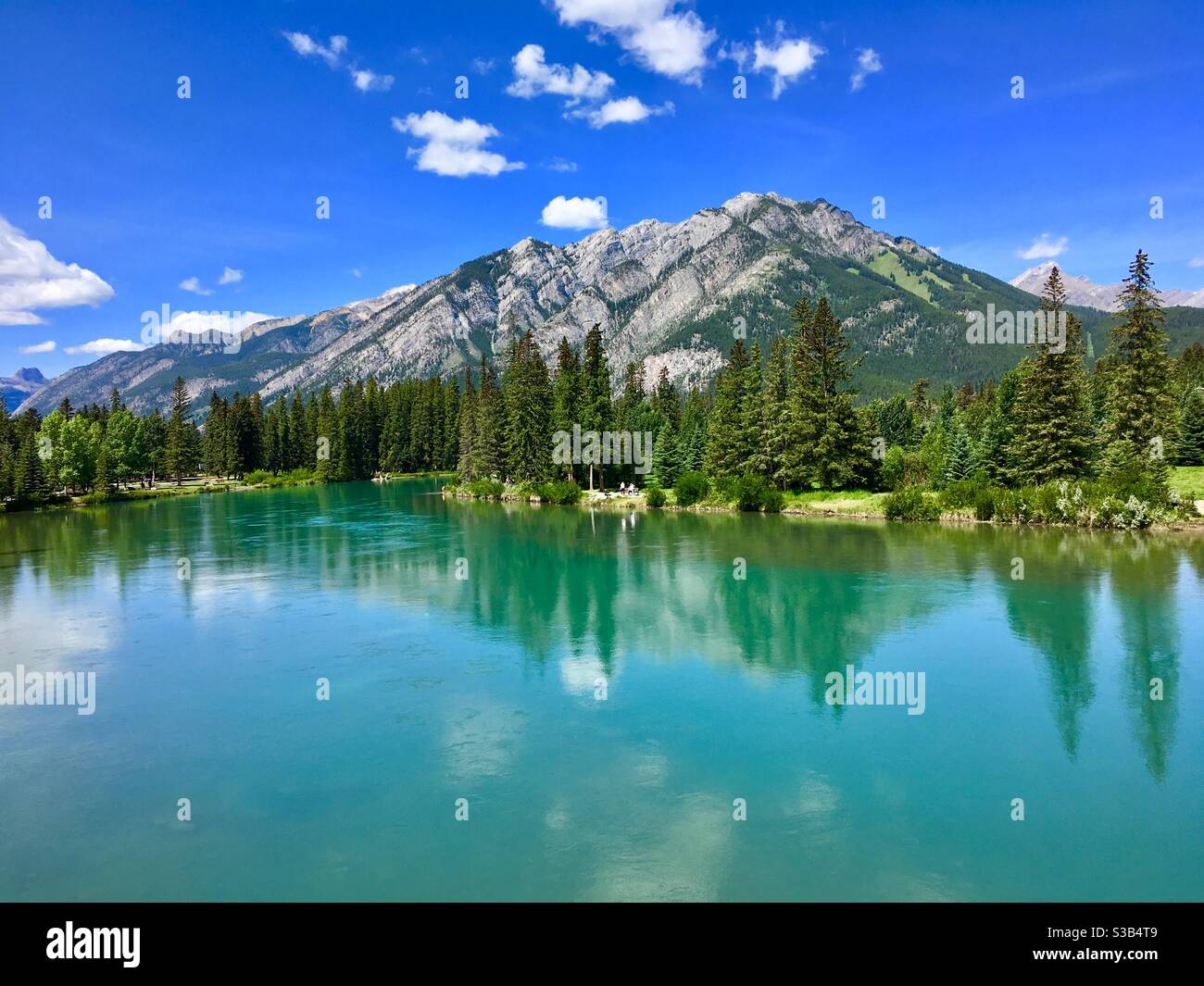 The blue waters of the Bow River, Banff, Alberta Stock Photo - Alamy