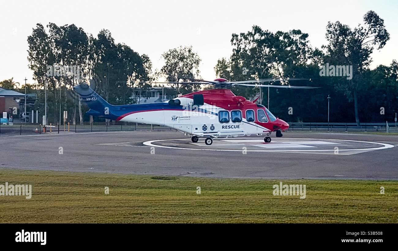 Emergency rescue helicopter landing in hospital grounds at Townsville ...