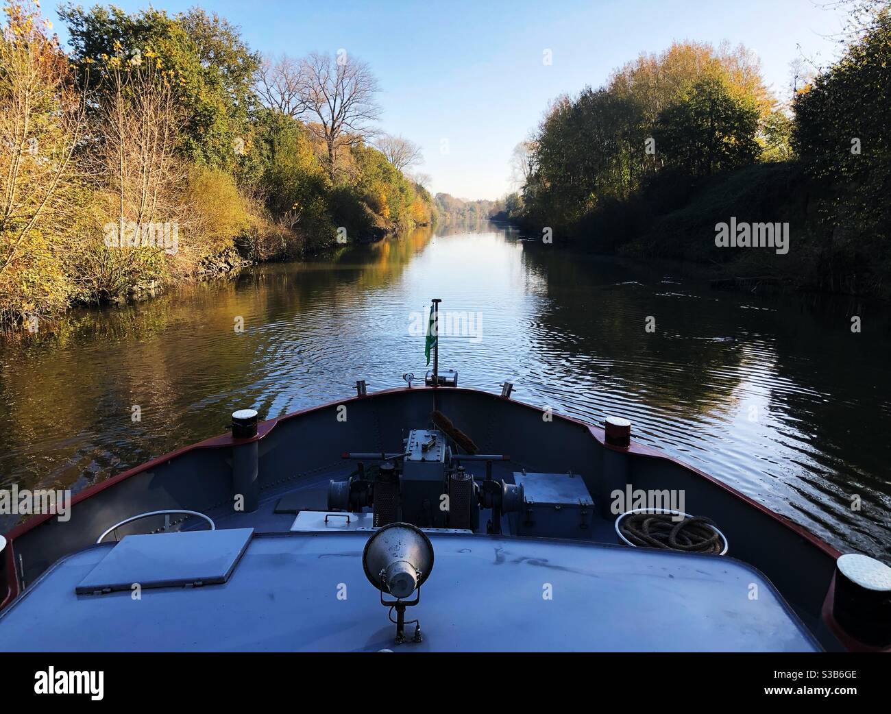 Canal barge on a river Stock Photo - Alamy