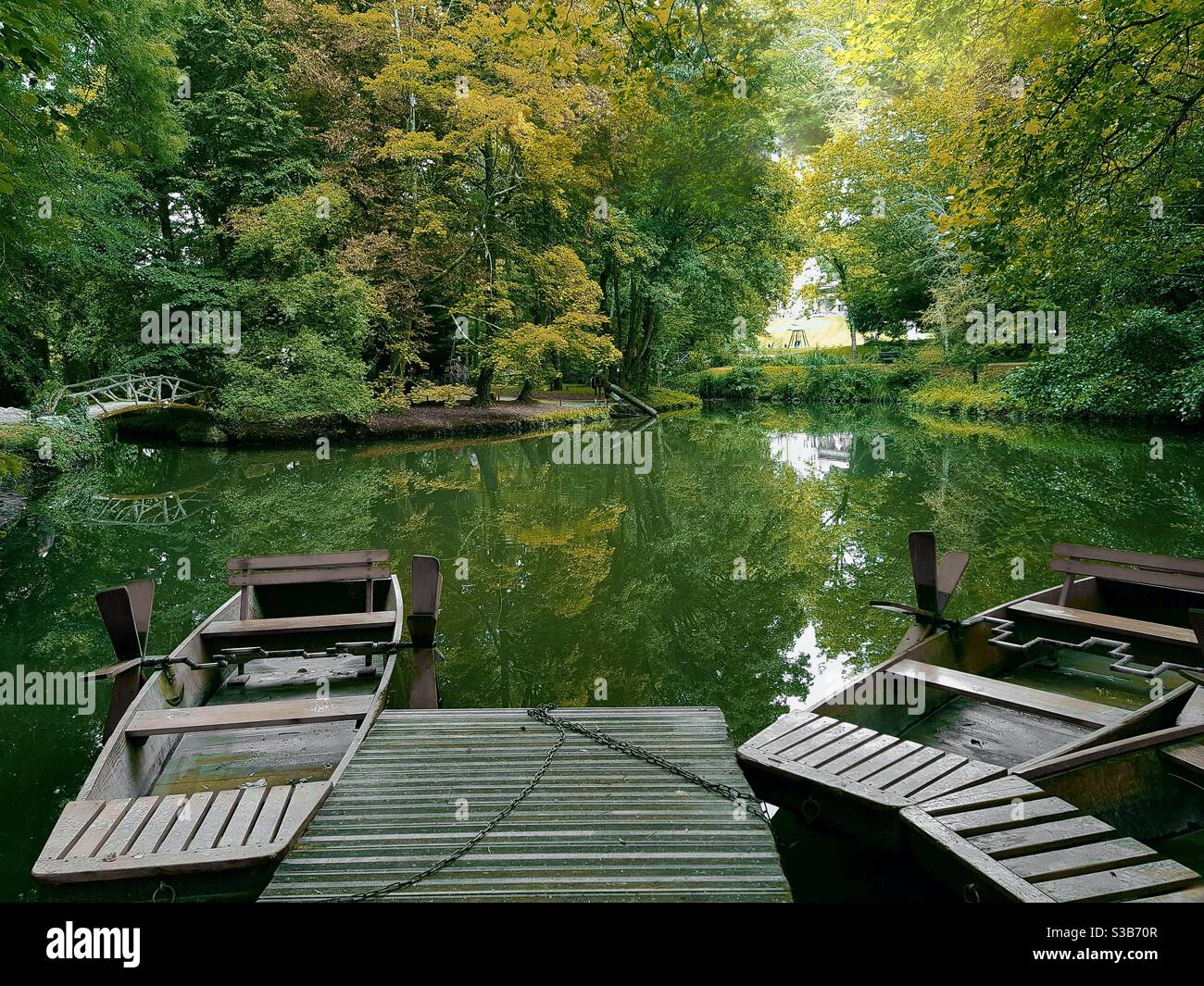 Green Landscape with Two Boats Stock Photo - Alamy