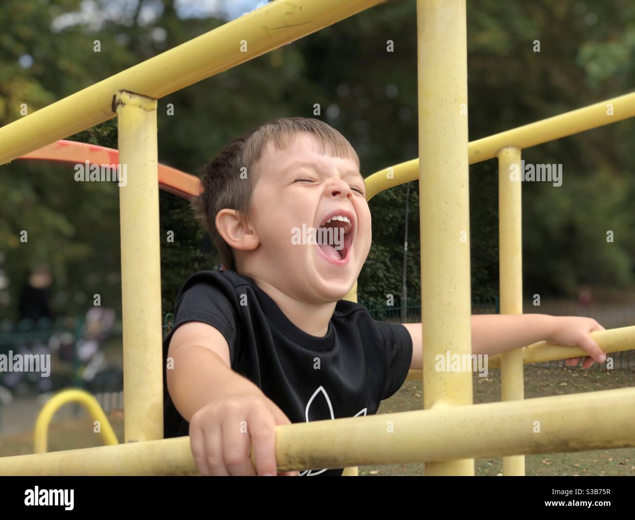 Young boy laughing hi-res stock photography and images - Alamy