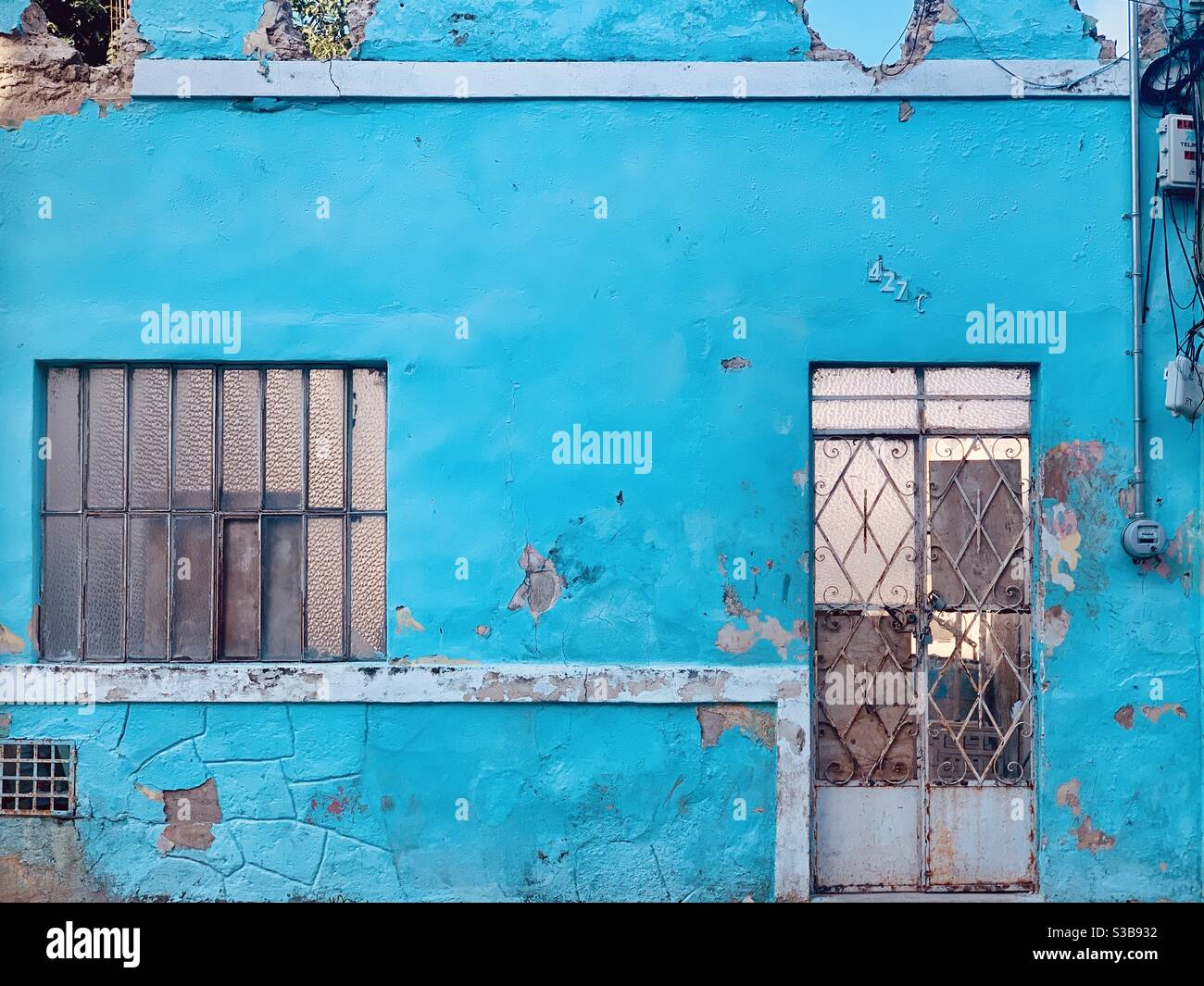 Decrepit facade of a house Stock Photo - Alamy