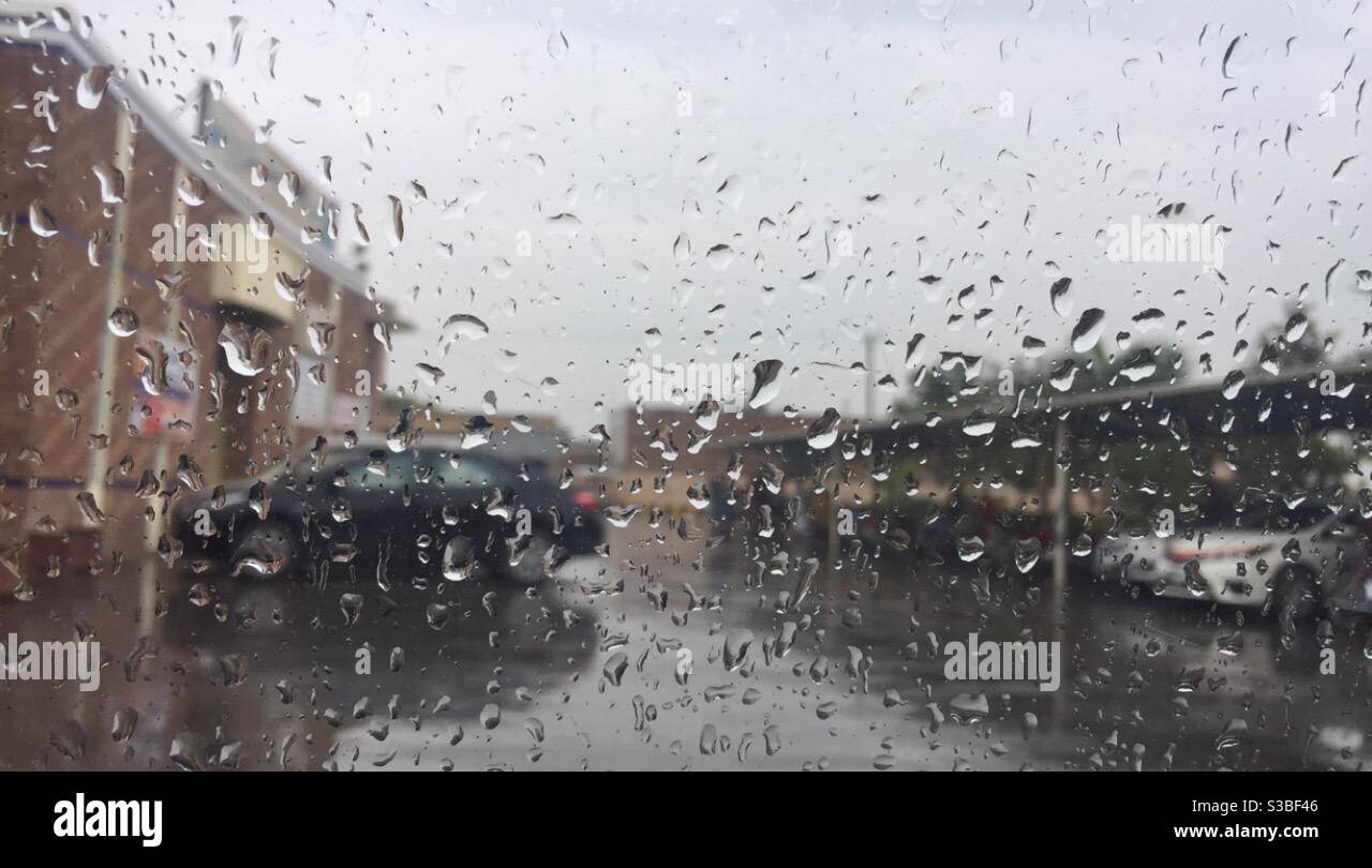 Day raining and nostalgia with the rain drops flowing by on glass ...