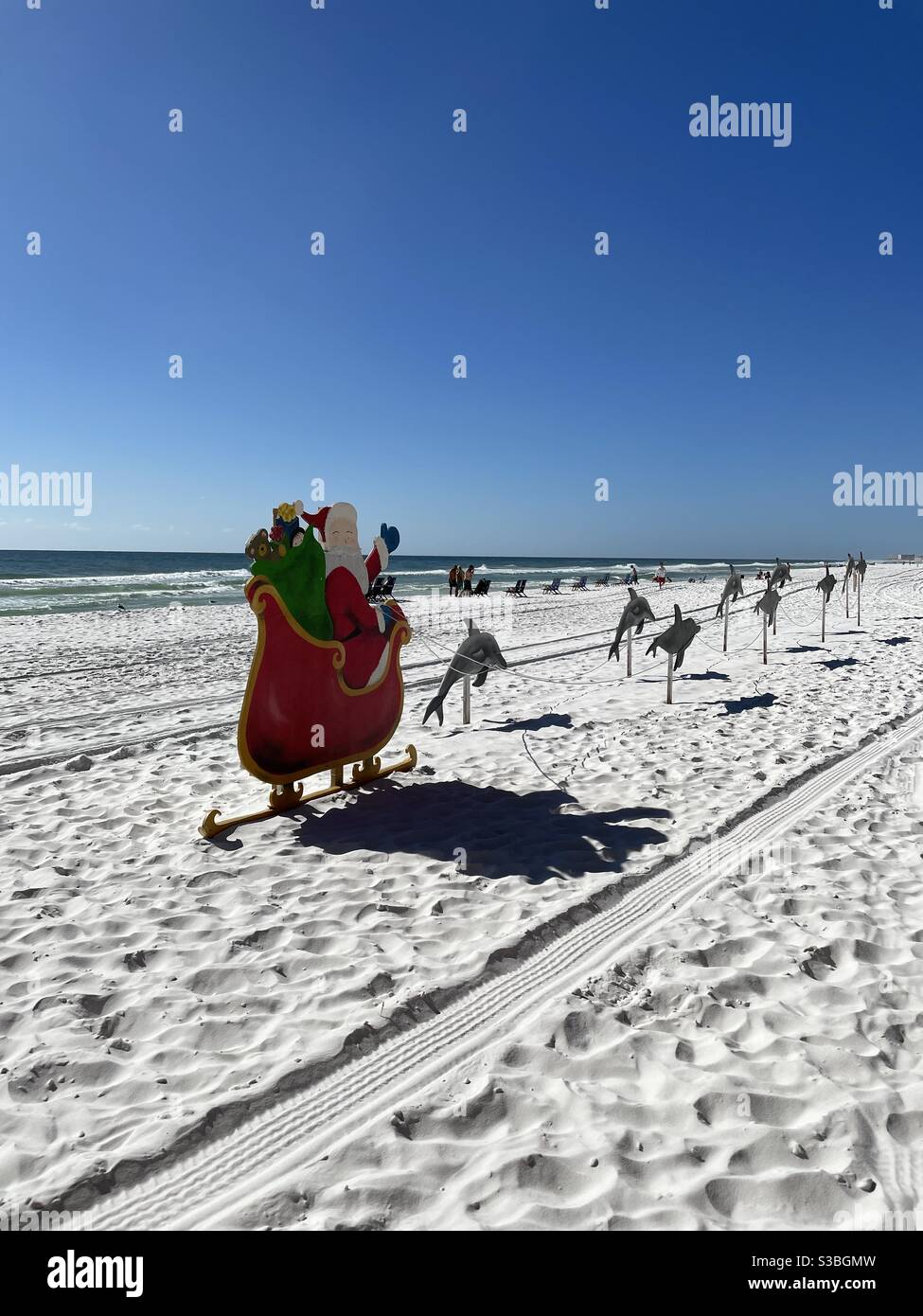 Christmas decorations on white sand Florida beach of Santa in a sleigh ...