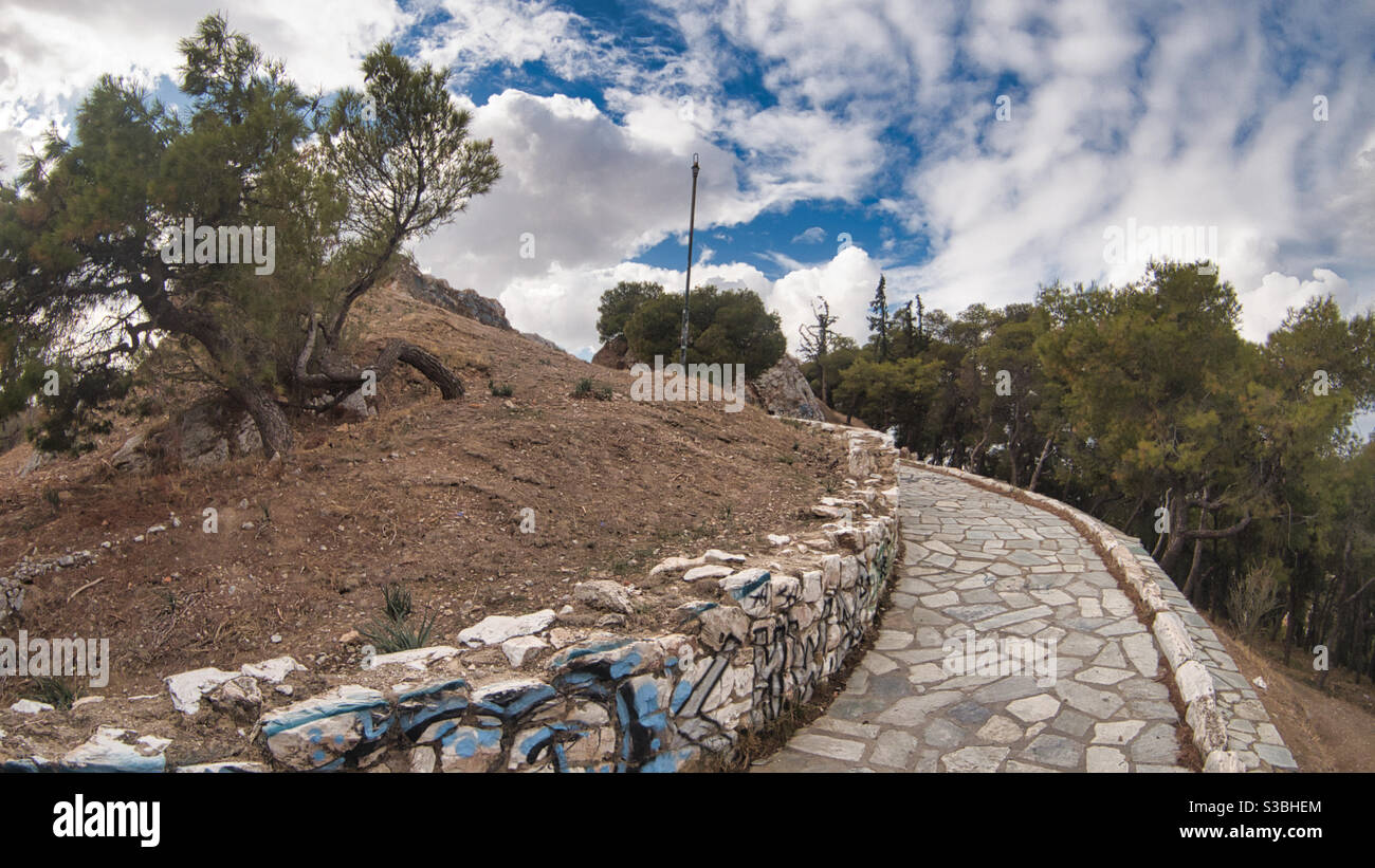 Stone path at Strefi Hill, a popular park in downtown Athens, Greece ...