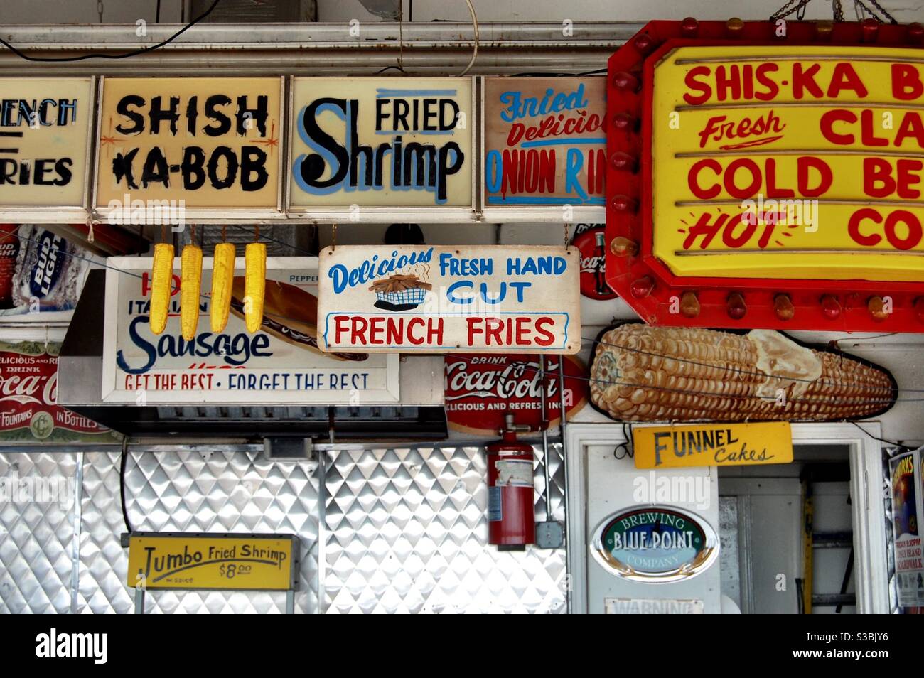 Food vendor stall signs in Coney Island amusement park Stock Photo - Alamy