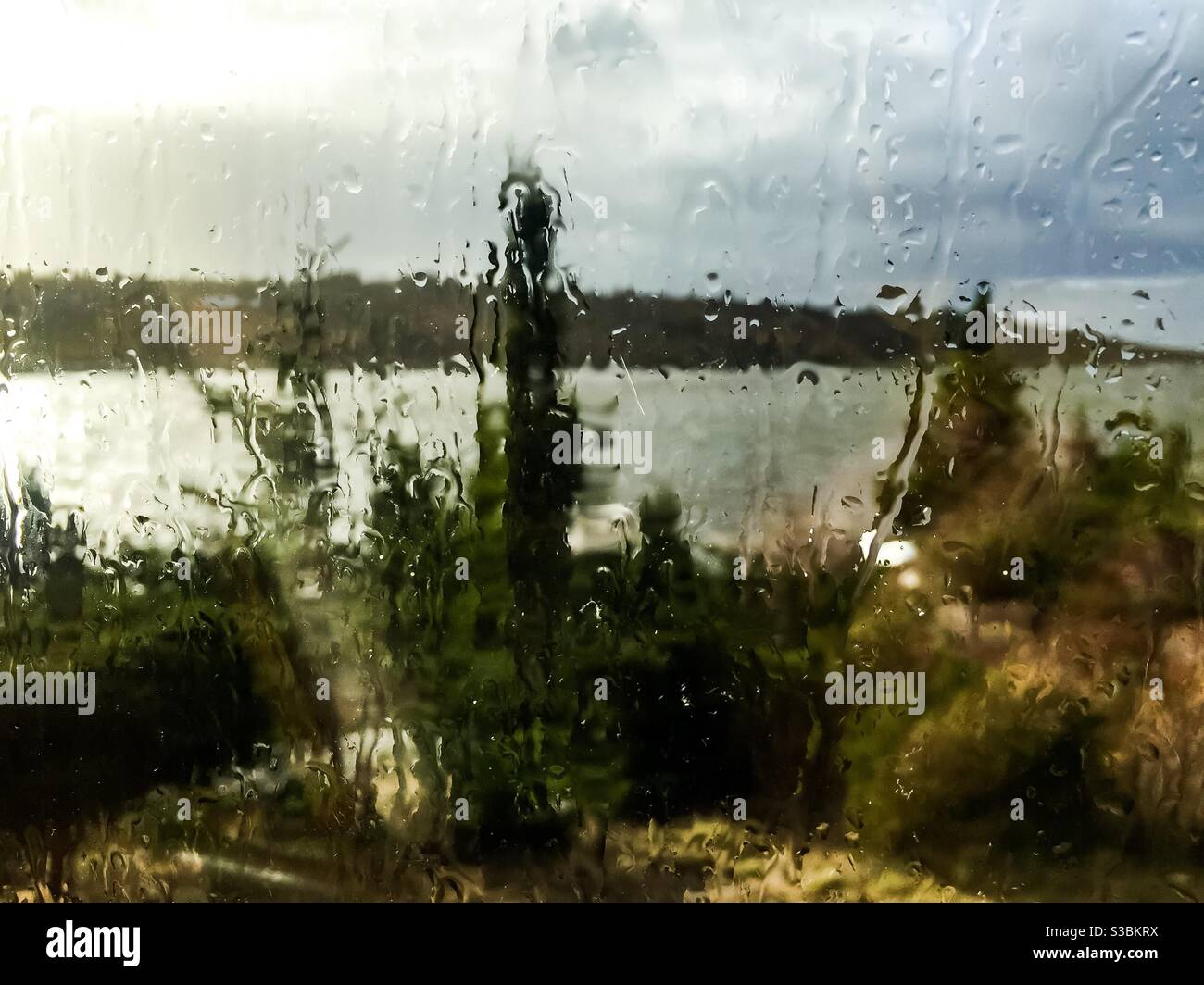 Heavy rain on a winter’s day, Halifax, Canada. Water streaming down a ...