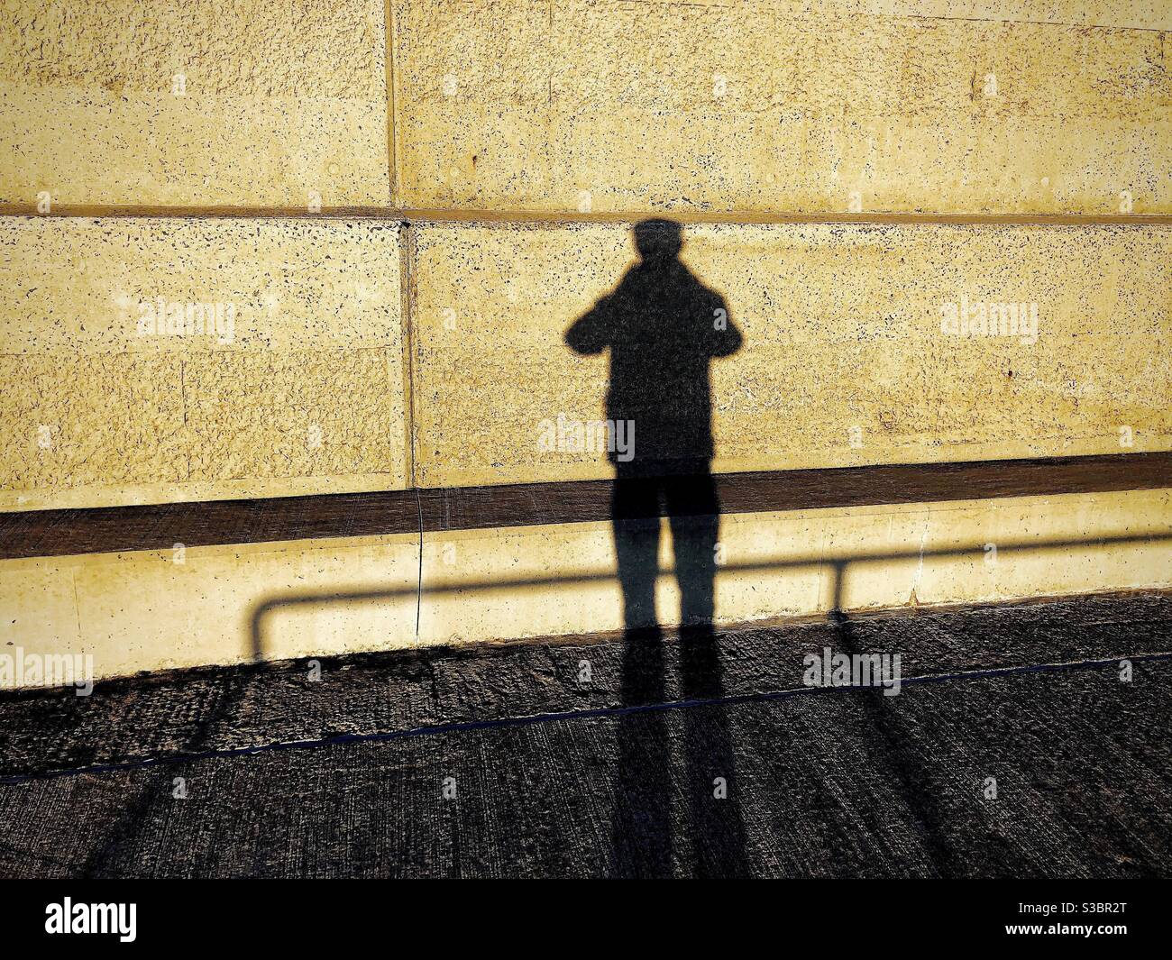 Shadow wall man High Resolution Stock Photography and Images - Alamy