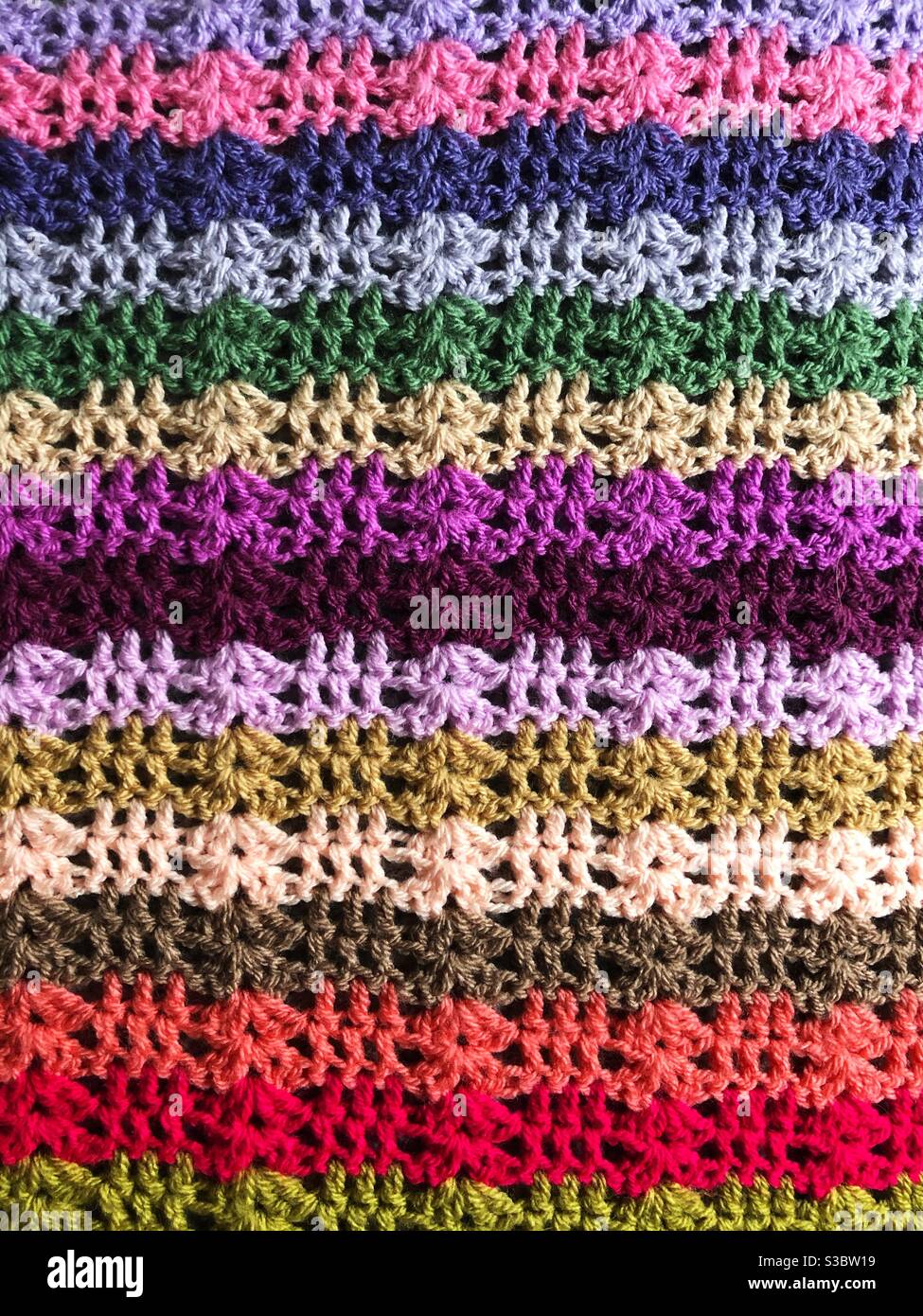Crochet background of the colourful stitching and crocheting of a ...
