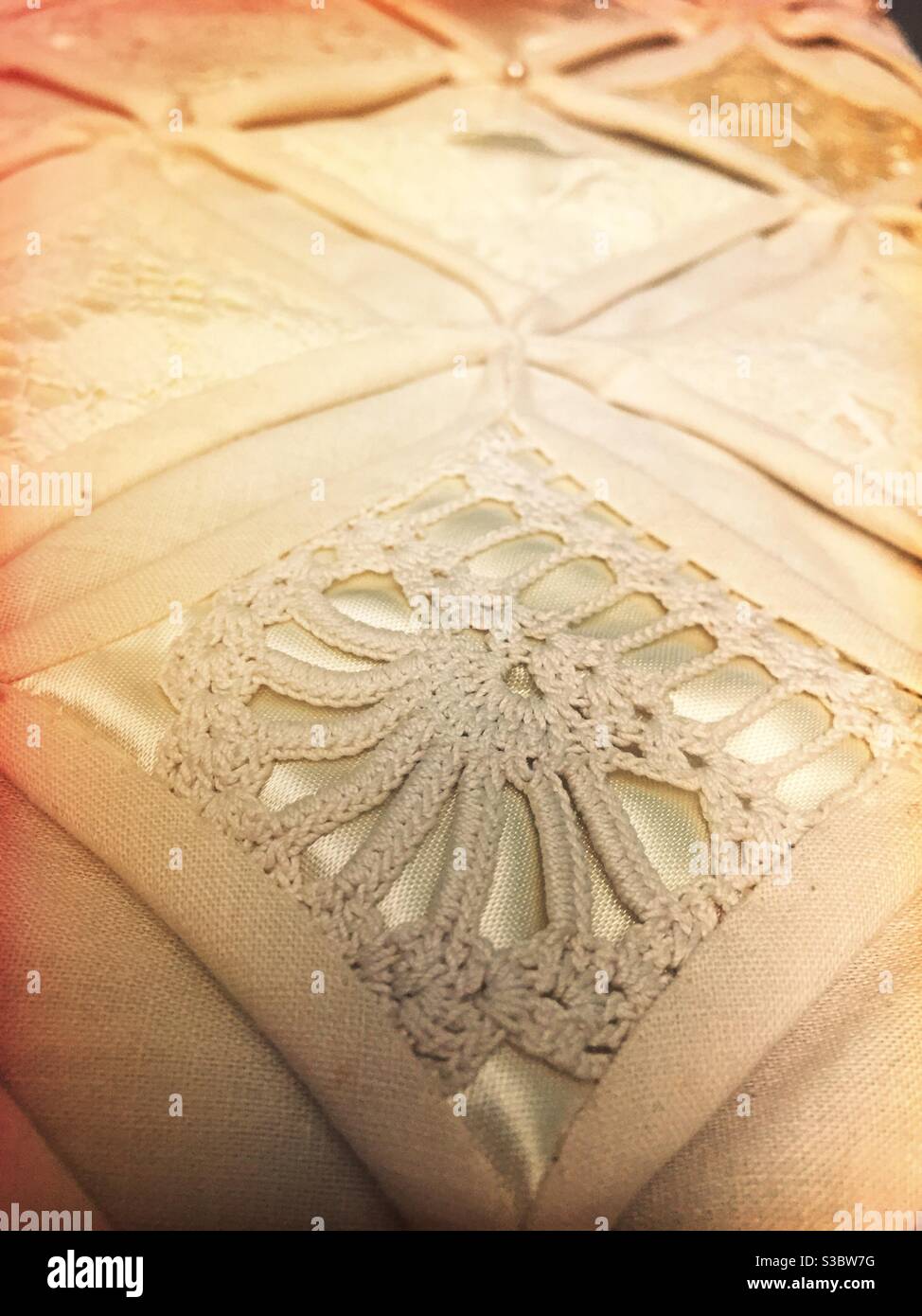 Handmade quilt in a cathedral window pattern design Stock Photo - Alamy