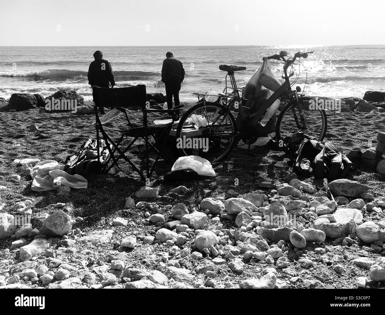 Two men sea in Black and White Stock Photos & Images - Alamy