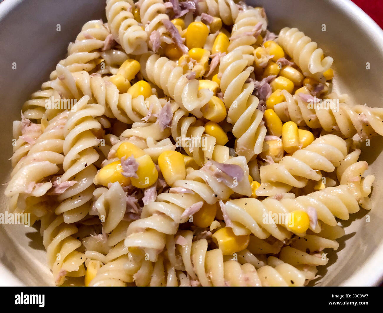 Tuna and sweetcorn pasta salads made with spiral pasta Stock Photo - Alamy