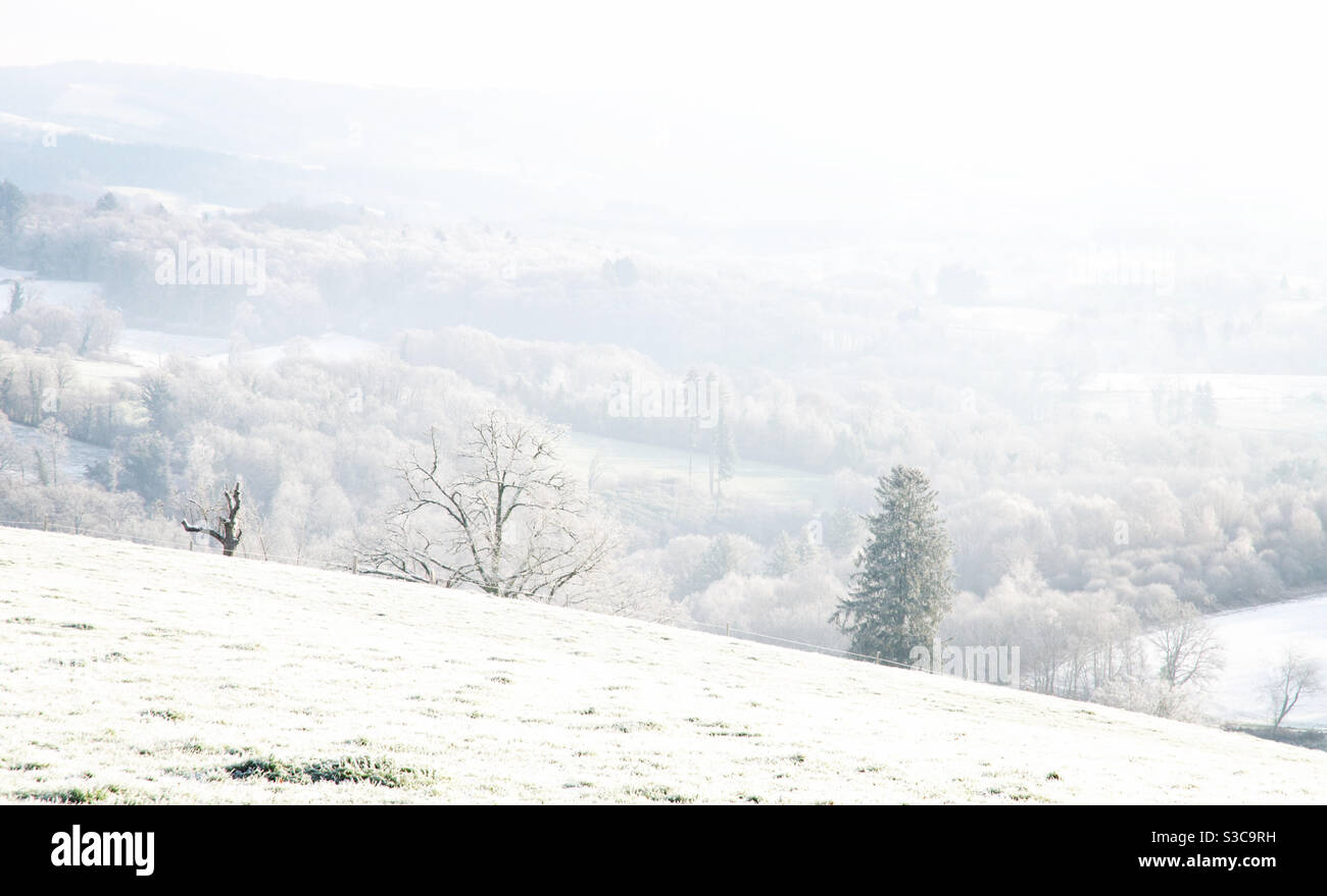 A snowy hilly landscape in the French countryside Stock Photo - Alamy