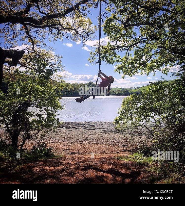Child swinging on rope hi-res stock photography and images - Alamy