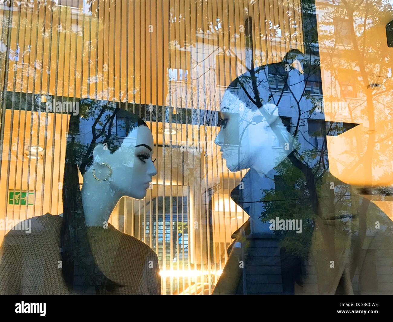 Two mannequins in a shop window Stock Photo - Alamy