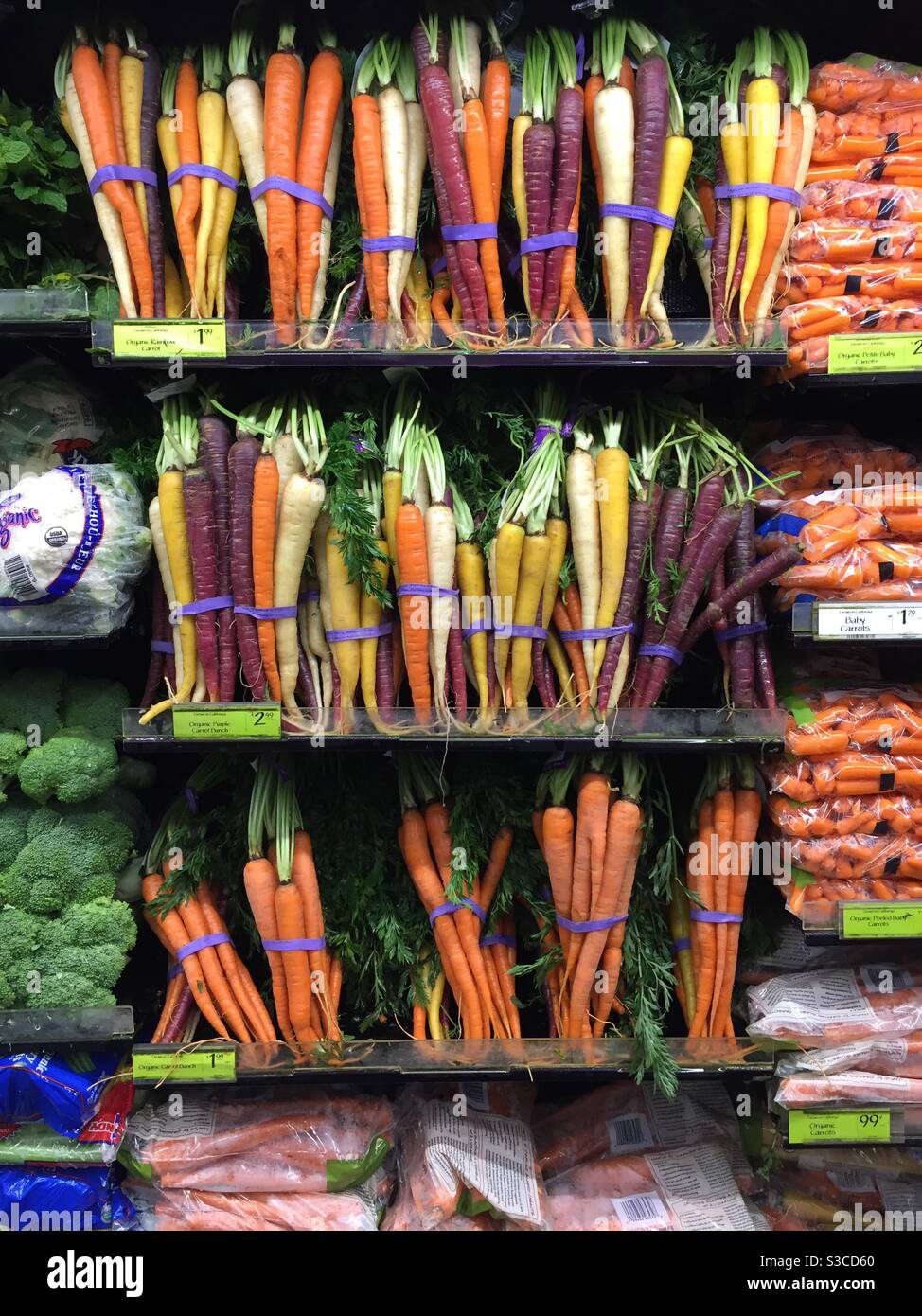Crunches of colorful carrots on sale at a grocery store Stock Photo - Alamy