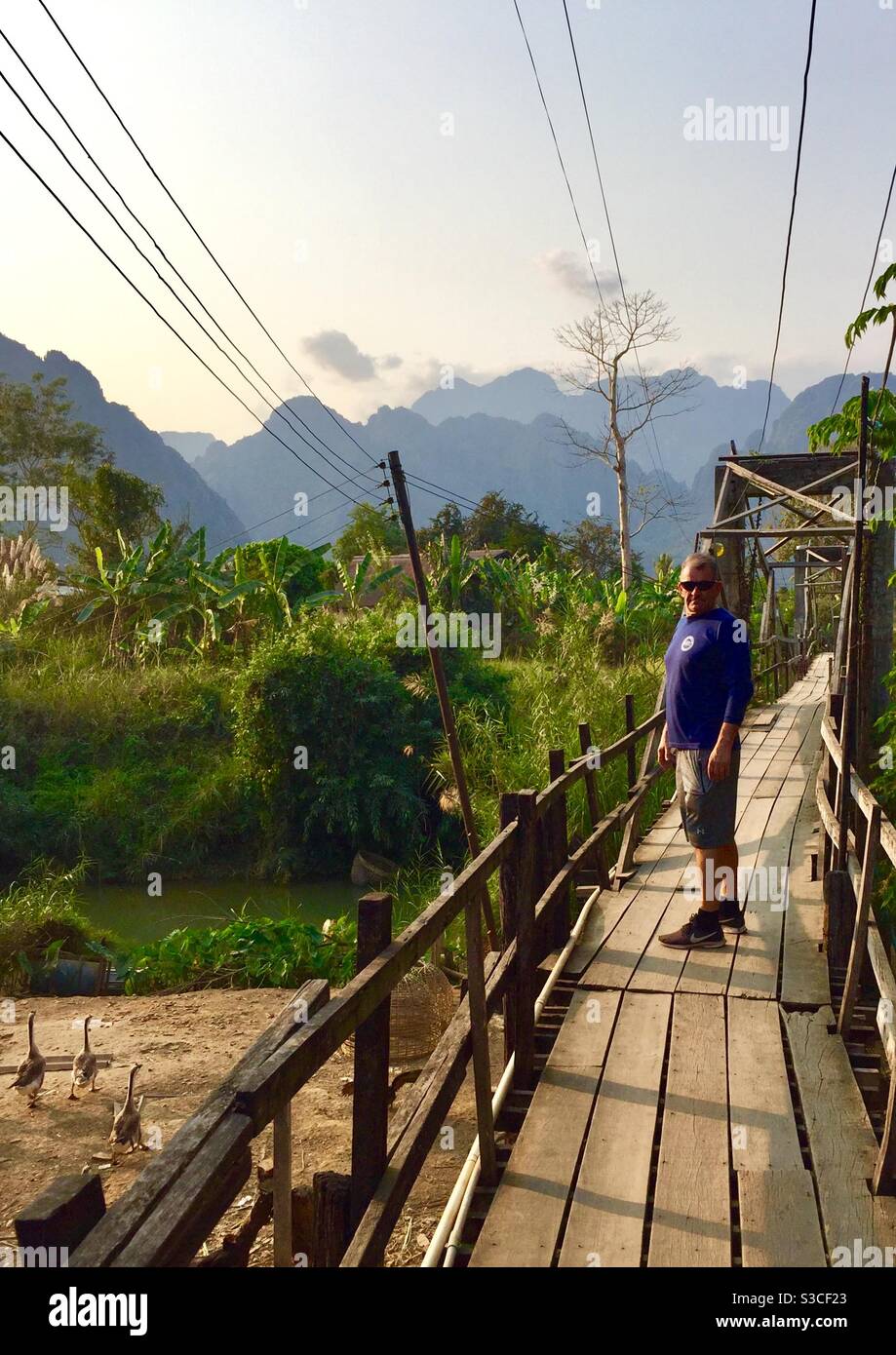 Wooden bridge in Vang Vieng Laos Stock Photo - Alamy
