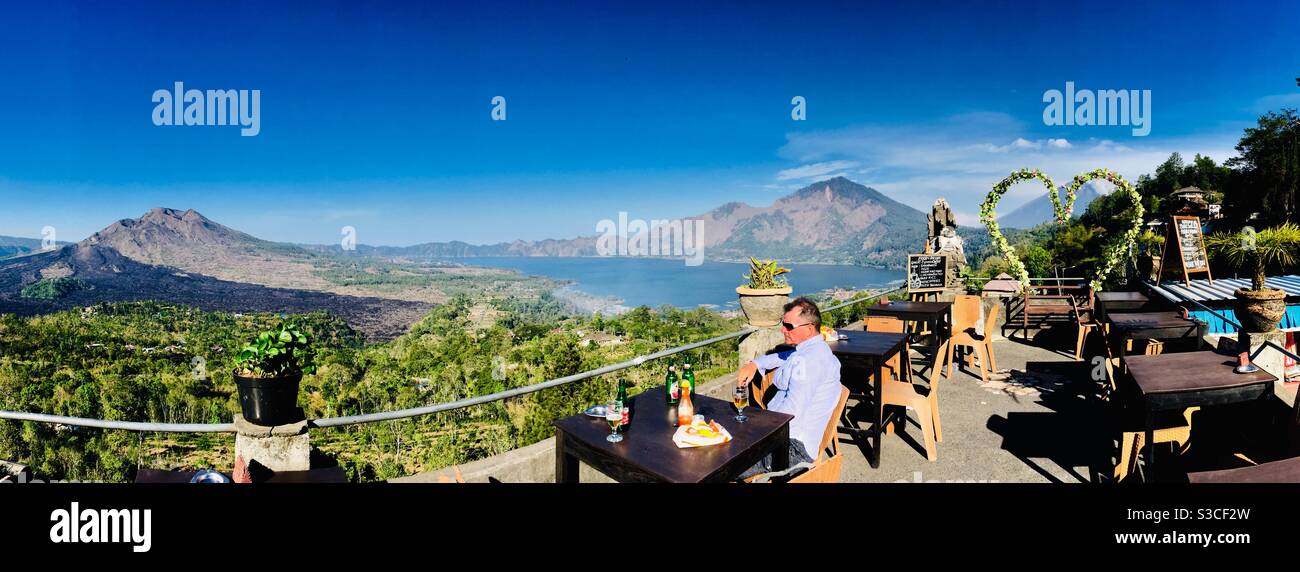 Beer with a volcano view Mount Batur Bali Indonesia Stock Photo - Alamy