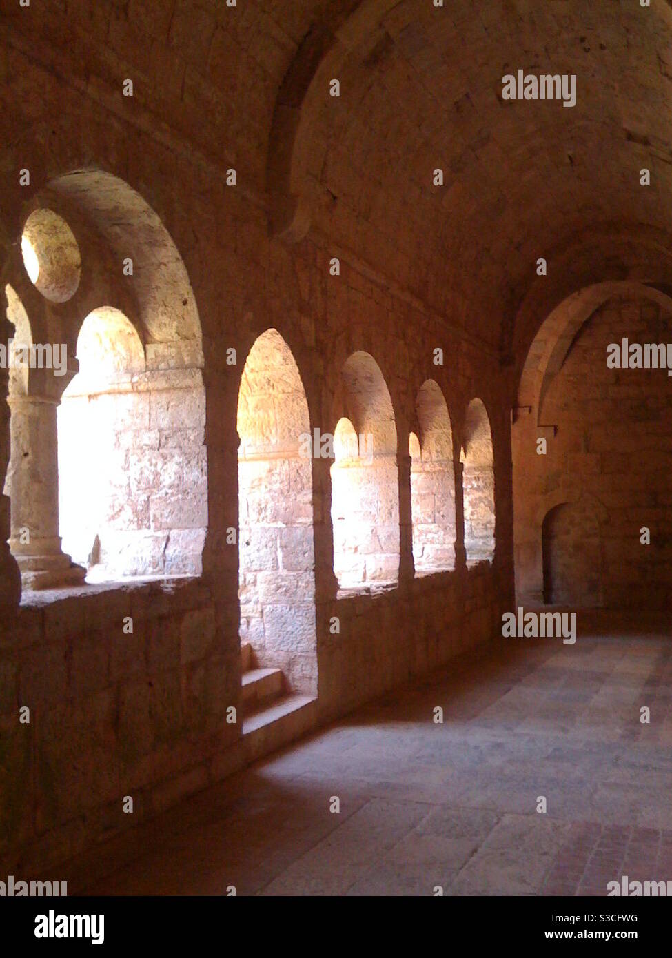 Old cloisters with arches and columns in French monastery Stock Photo ...