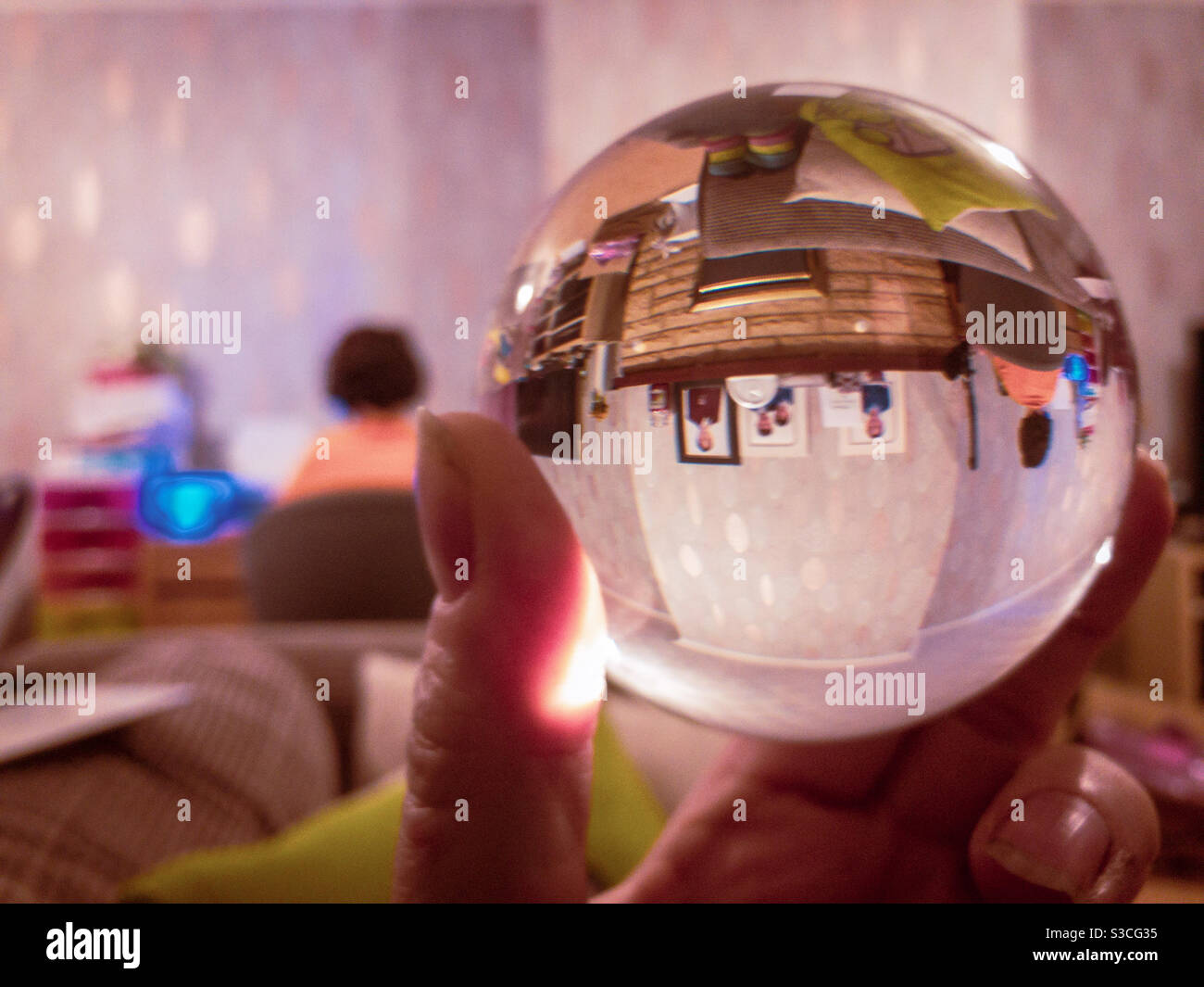 Scene in front rooms seen in a glass lens ball Stock Photo - Alamy