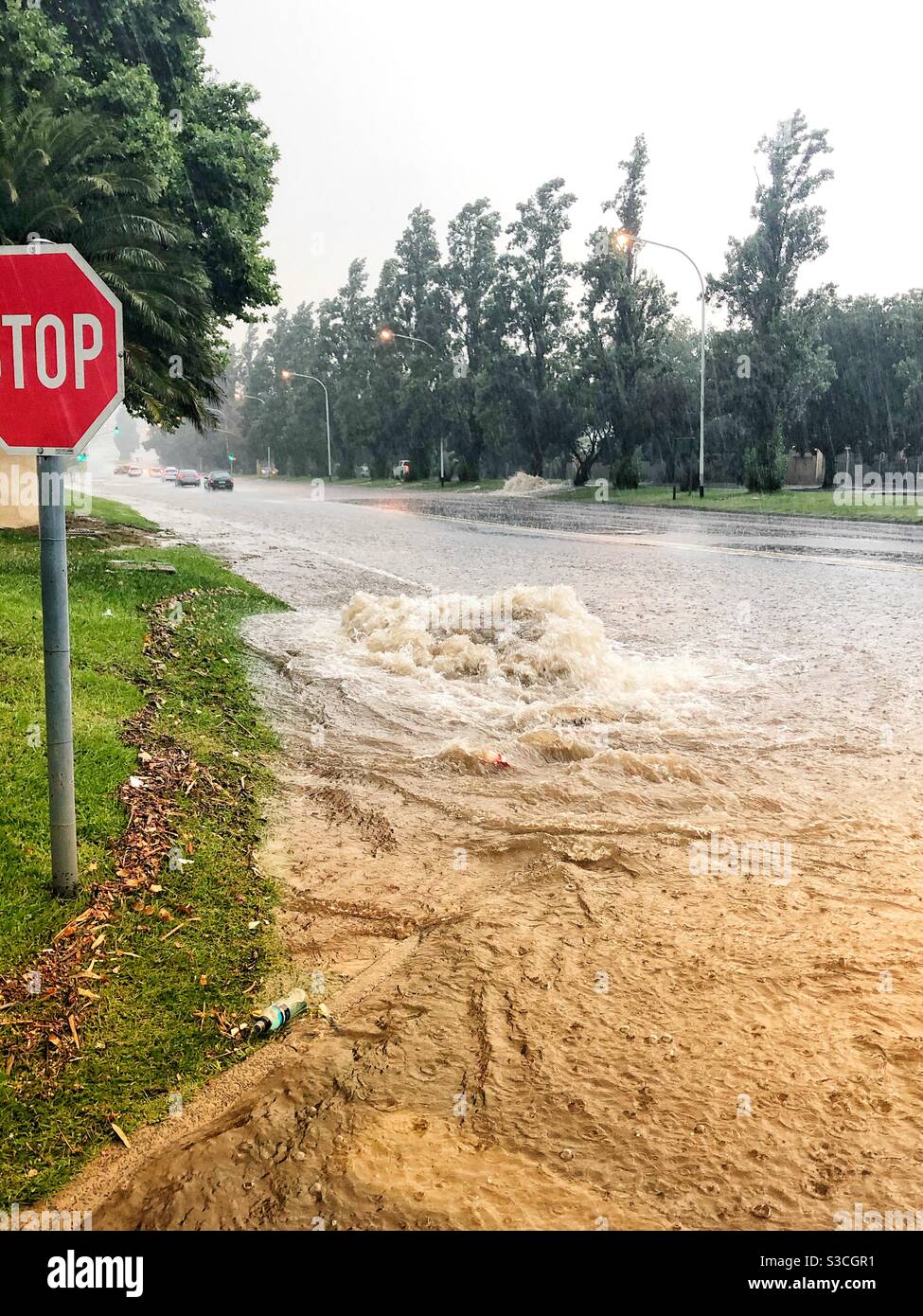 Overflowing drains after extremely heavy rain Stock Photo - Alamy
