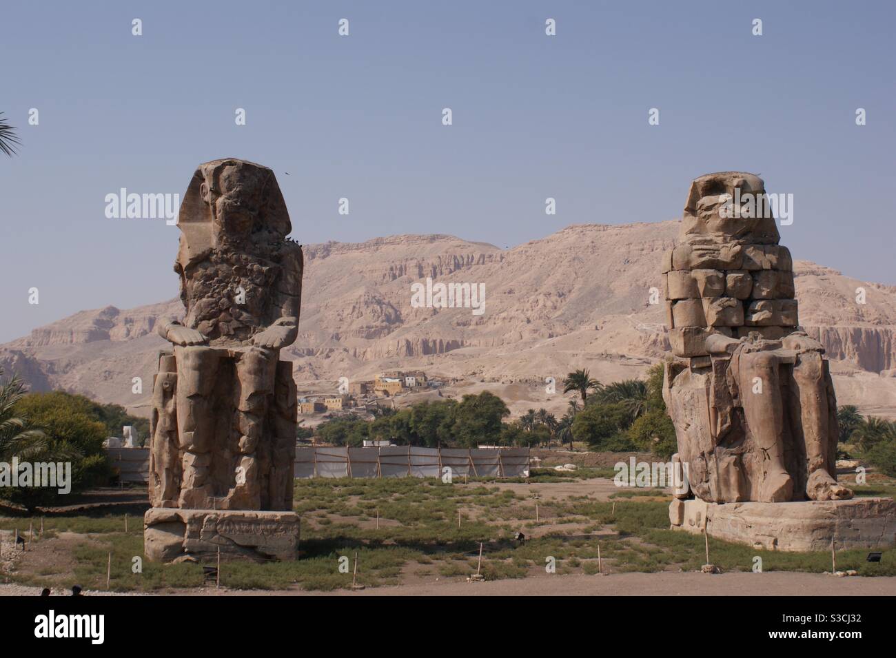 The Colossi of Memnon: stone statues of the Pharaoh Amenhotep III, in ...