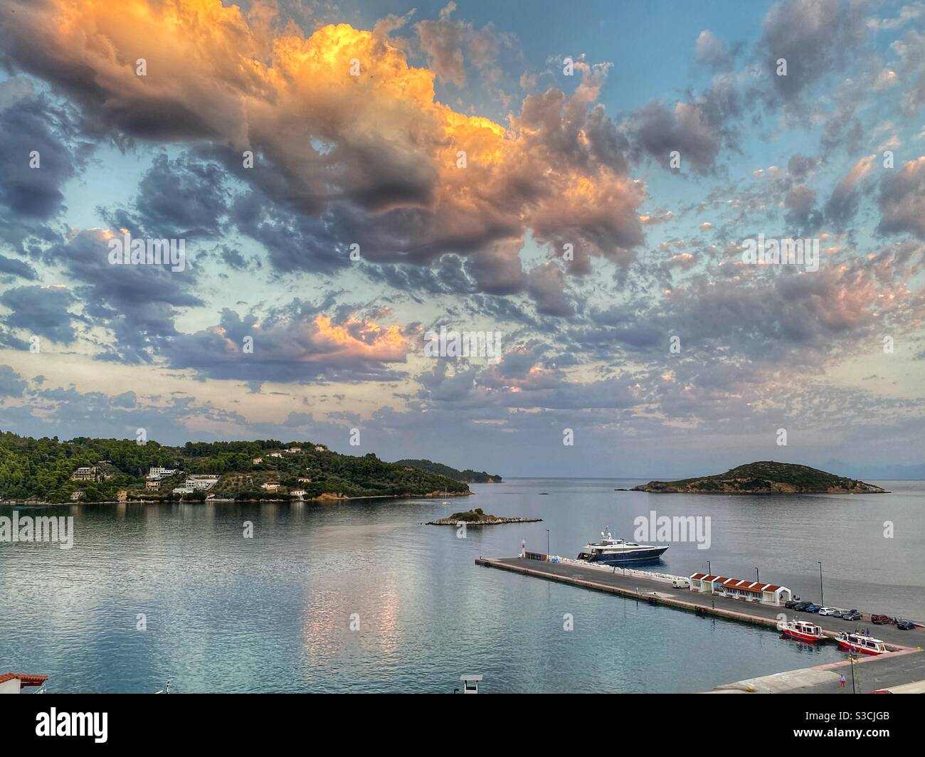 Night view at Skiathos port under sunset clouds Stock Photo - Alamy