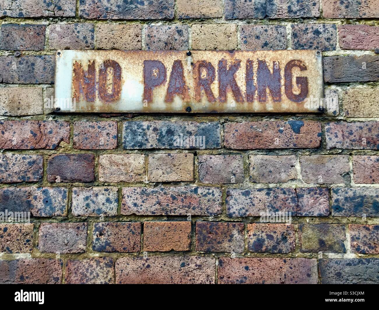 Rusty No Parking sign Stock Photo - Alamy