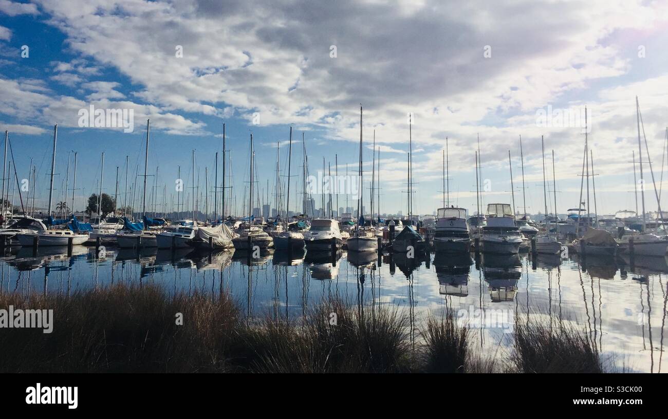 Boat reflections in the swan river at the South of Perth yacht club ...