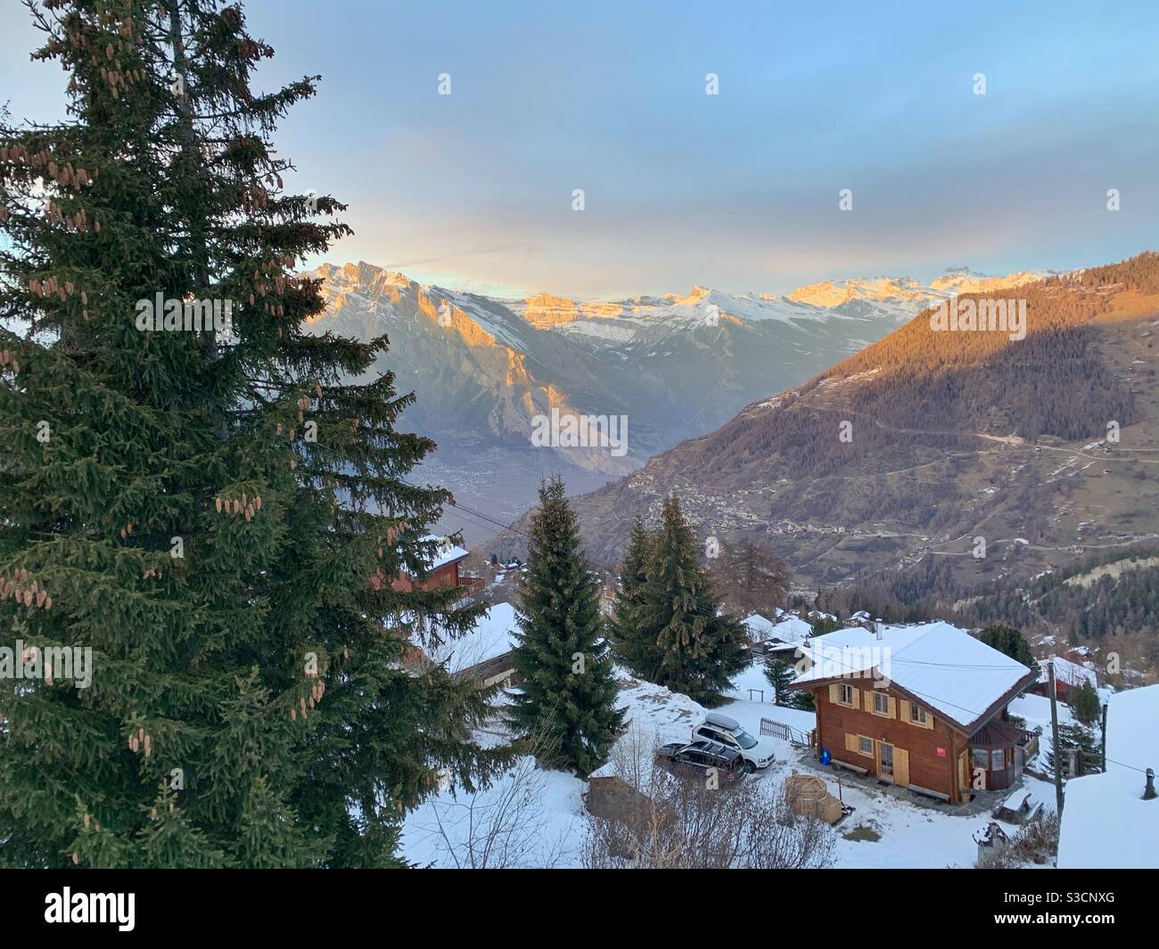 Wooden chalet and alpine trees on snow mountain Stock Photo - Alamy