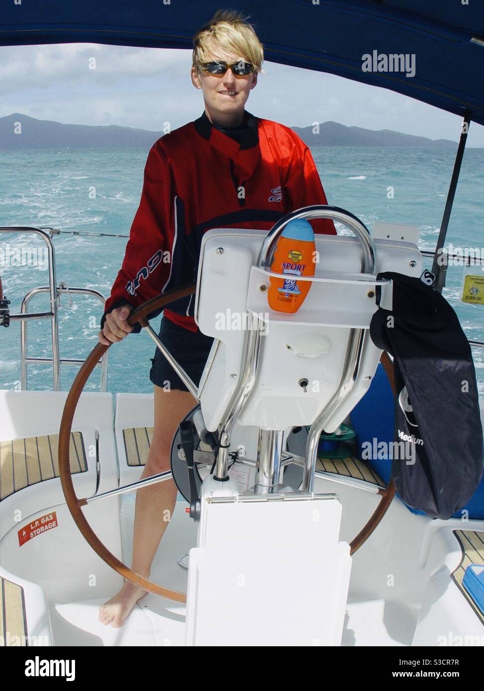 Women at the helm sailing a yacht in the Whitsundays Queensland ...