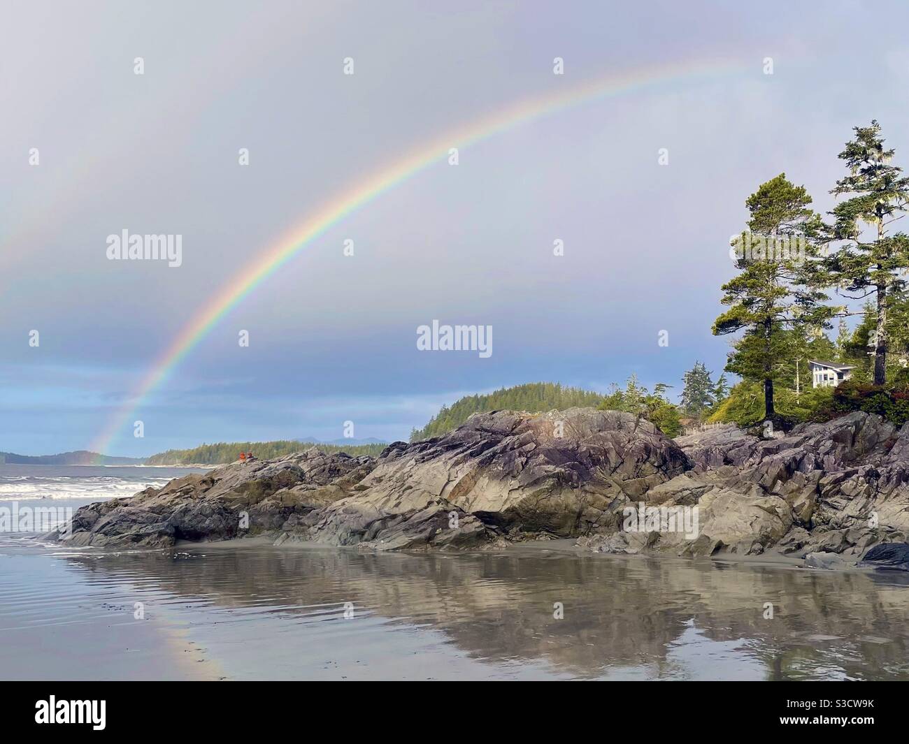Rainbow over Tonquin Beach Tofino BC Vancouver Island Canada Stock ...