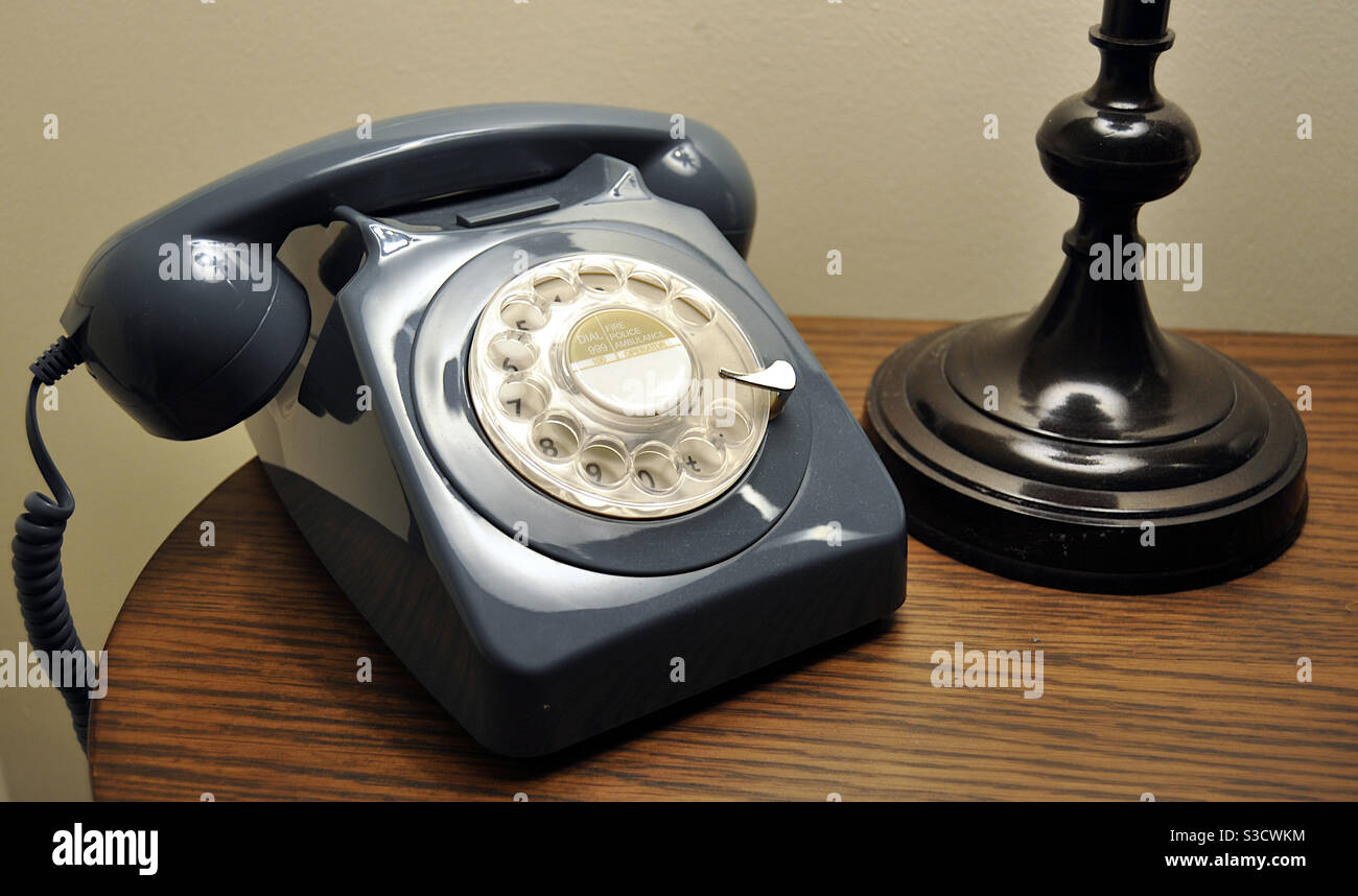 Retro UK telephone on desk with lamp base Stock Photo - Alamy