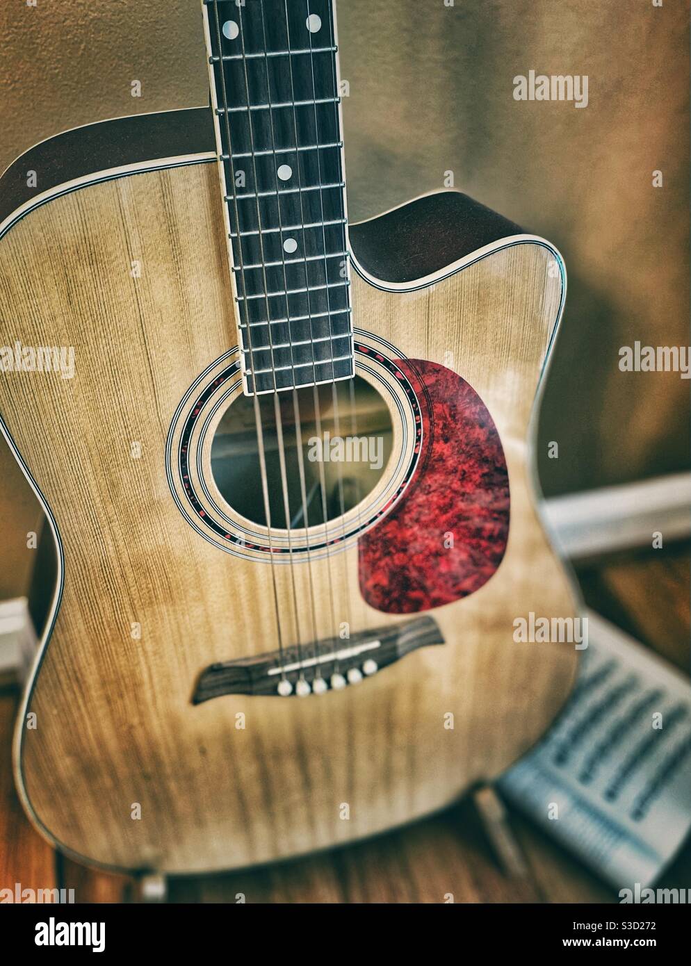 Acoustic guitar and sheet music abstract Stock Photo - Alamy