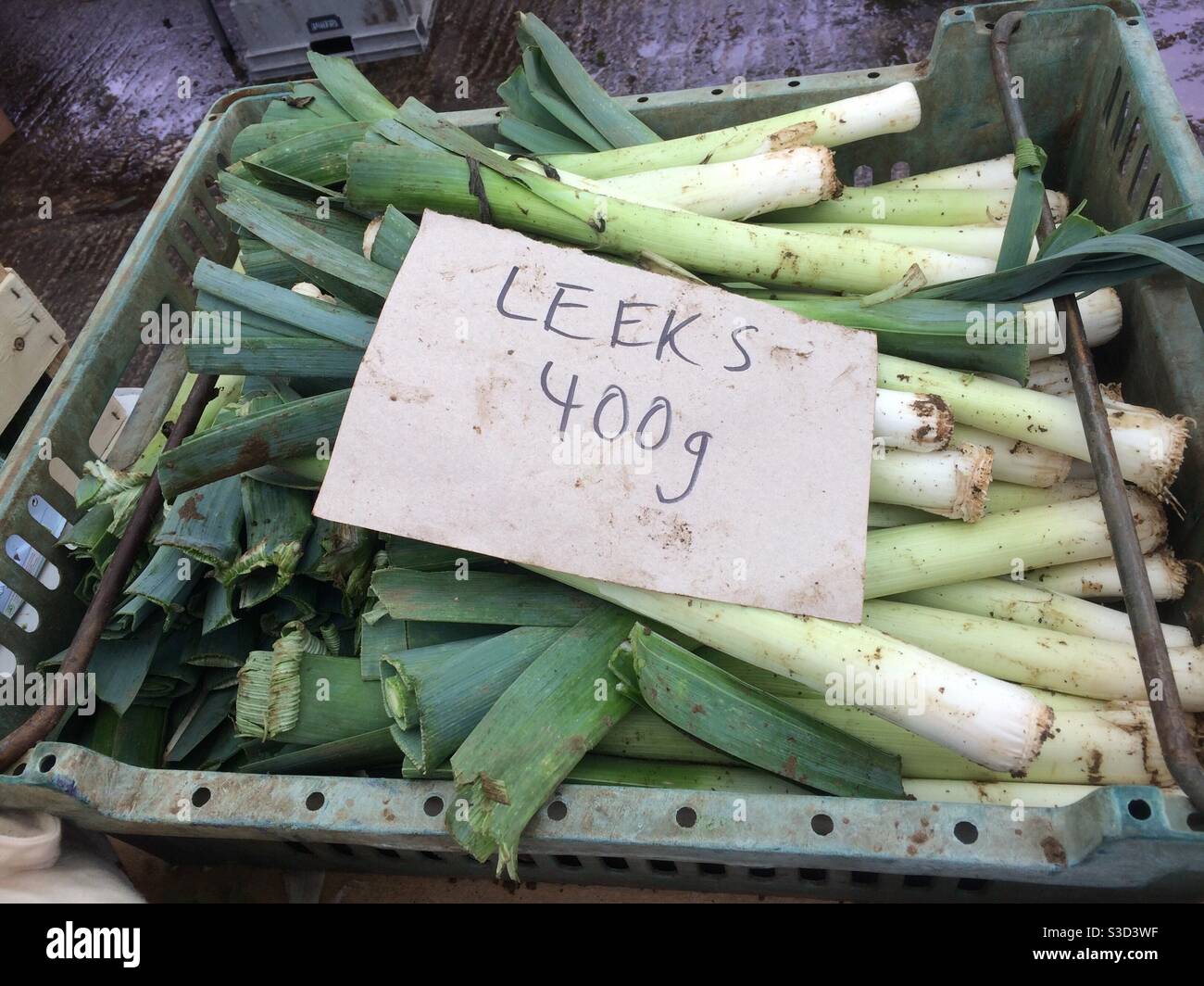 A crate of freshly harvested British organic leeks waiting to be ...