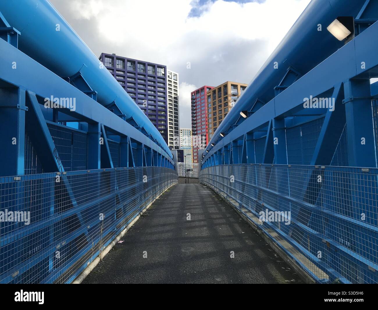 Blue bridge to City Island in Canning Town Stock Photo - Alamy