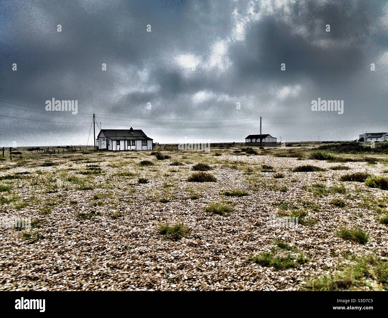 View across the vast brooding shingle beaches looking towards remote ...