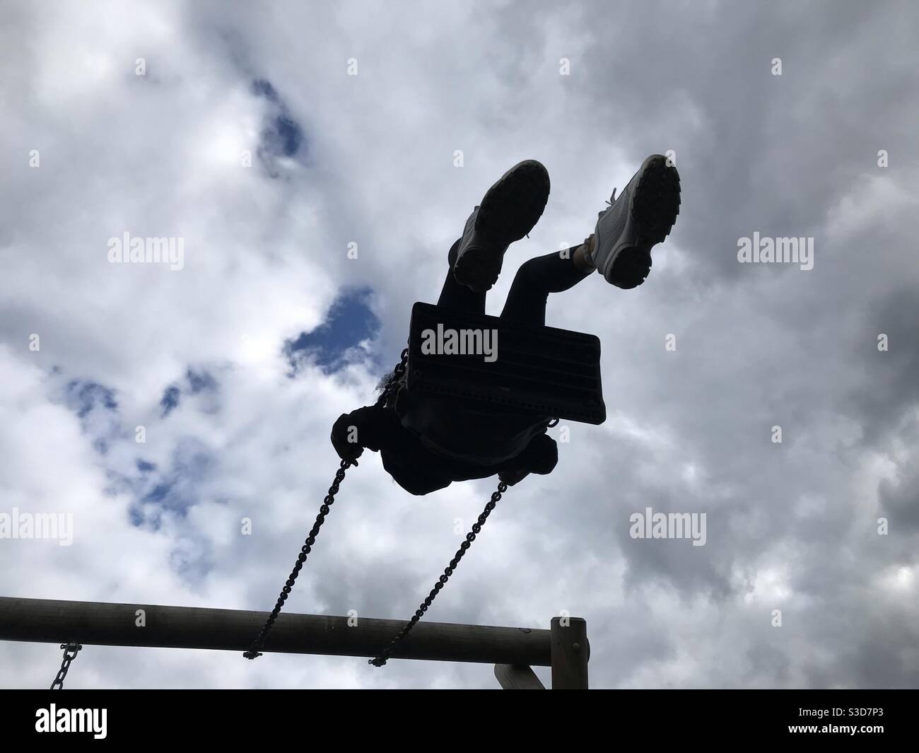 Child swinging high Stock Photo - Alamy