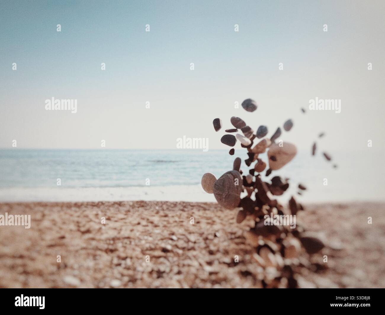 Floating rocks on beach Stock Photo - Alamy
