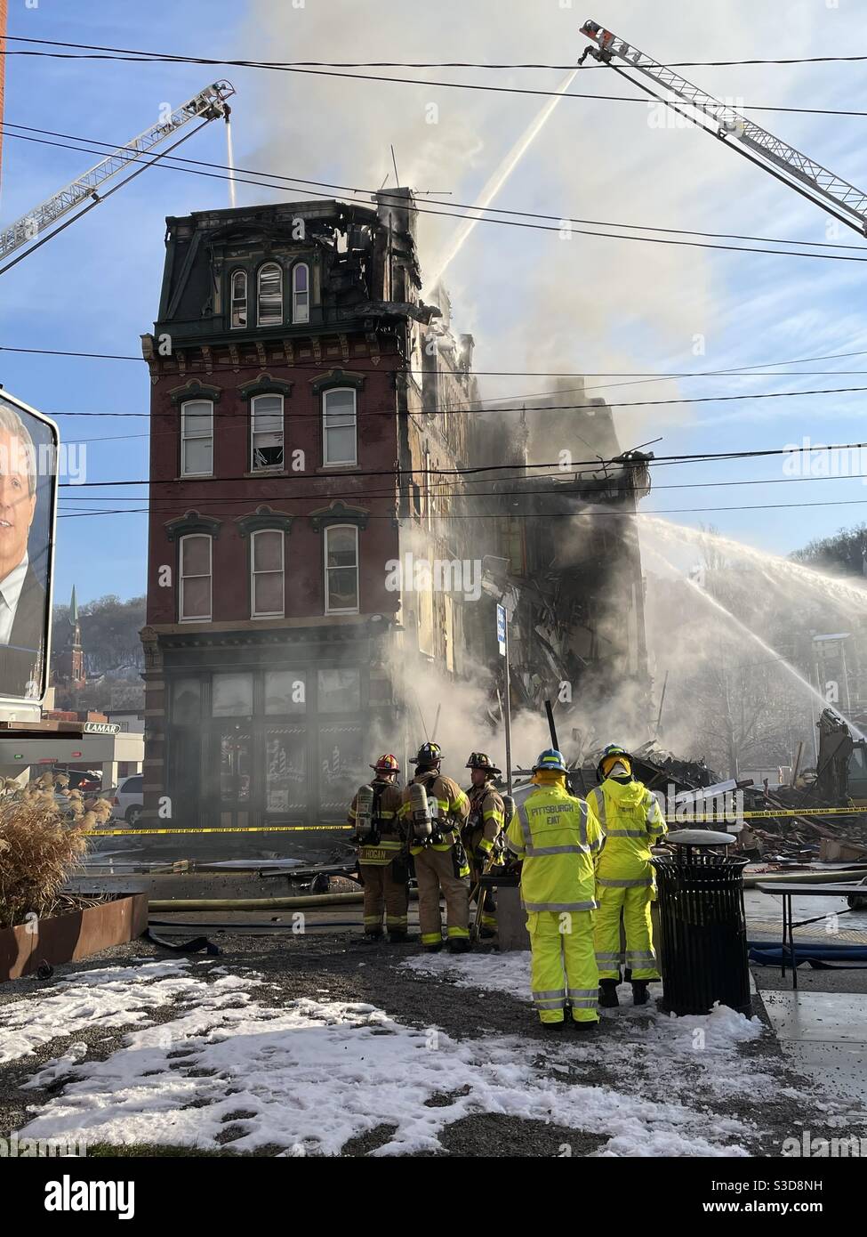 Firefighters battle a fire Stock Photo - Alamy
