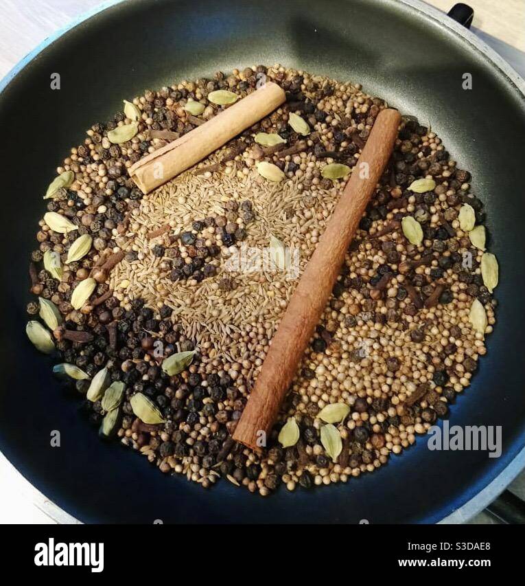Roasting spices on a pan Stock Photo - Alamy
